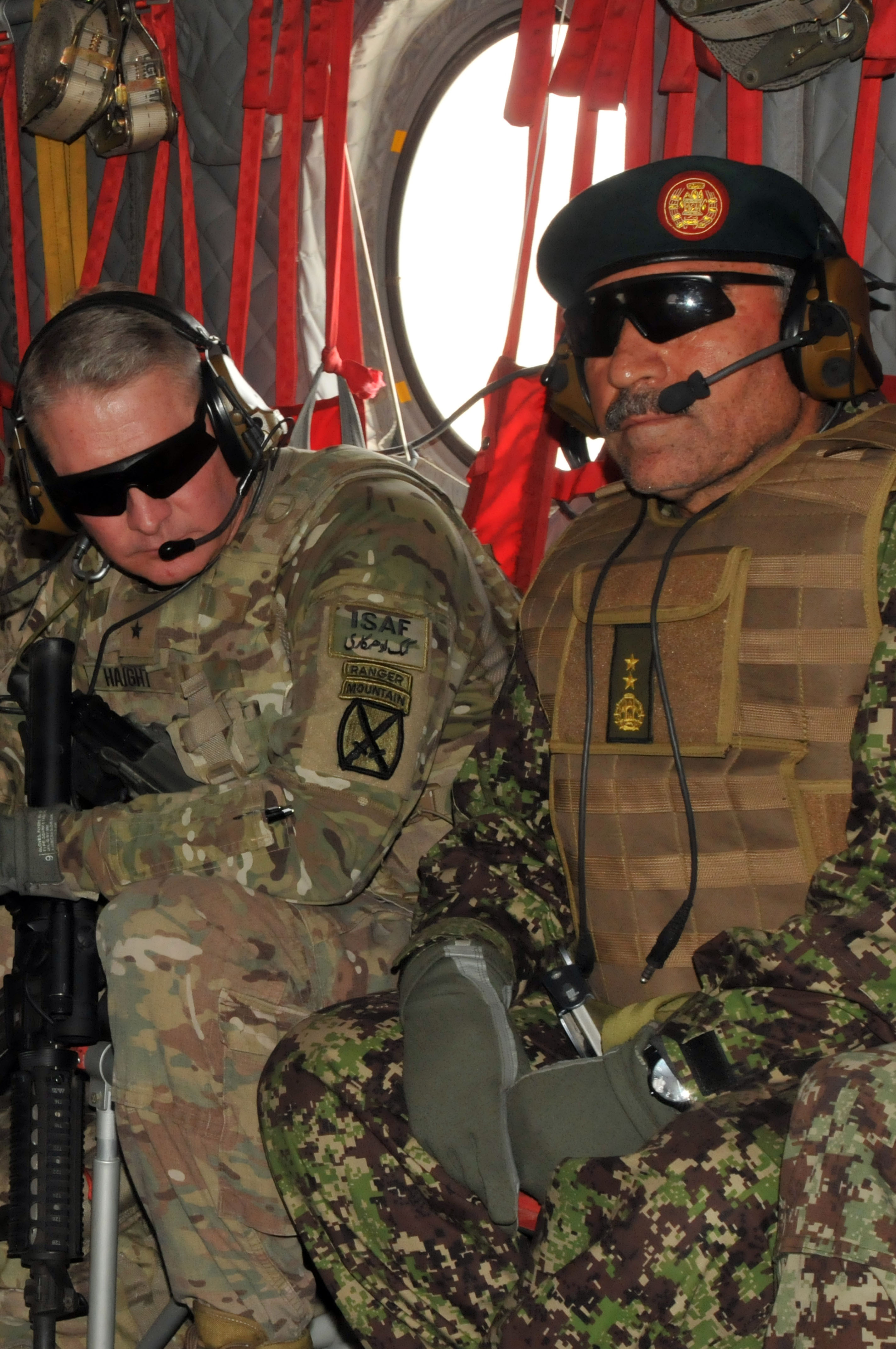 U.S. Army Brig. Gen. David Haight, left, talks with Afghan army Maj ...