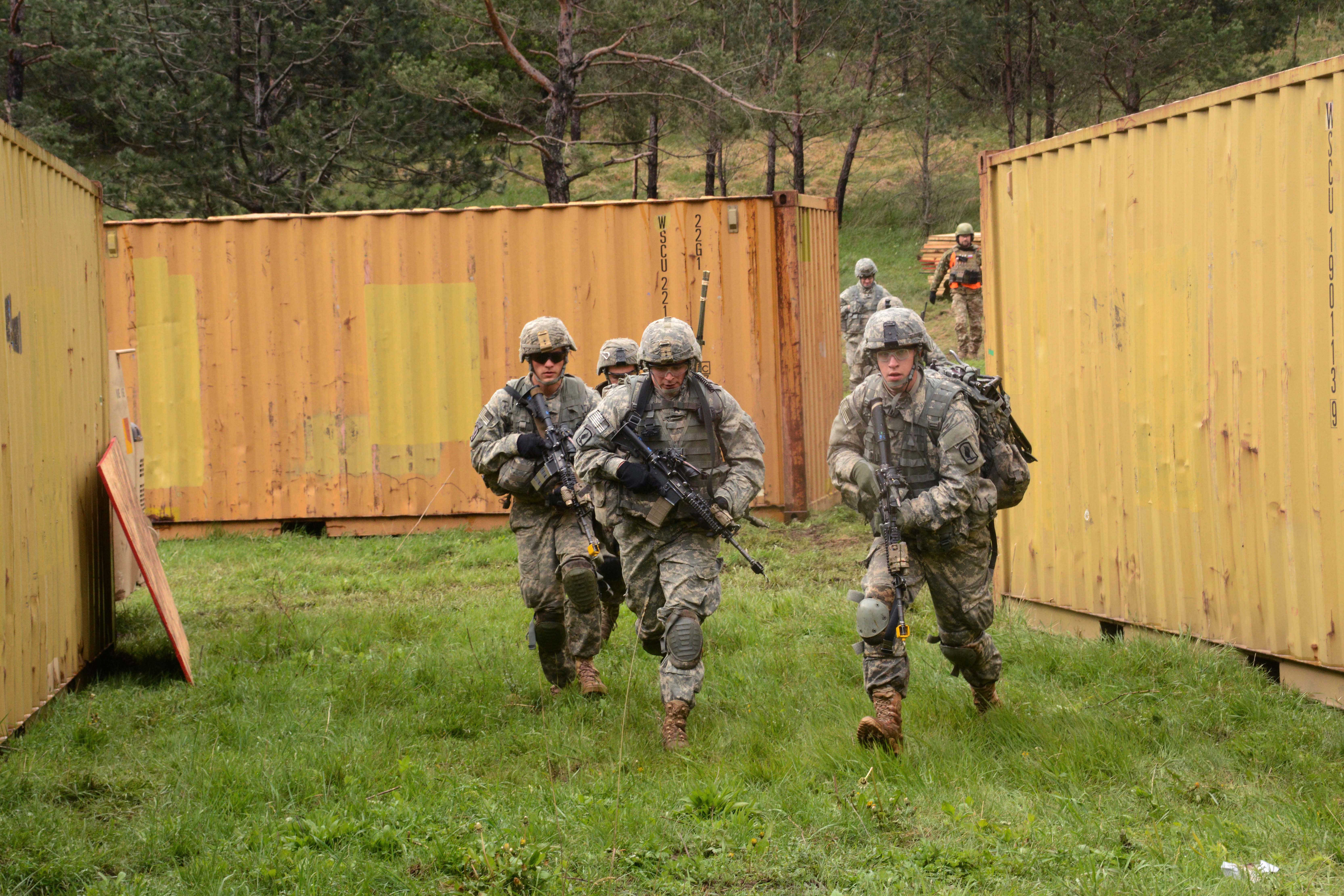 U.S. paratroopers engage opposing forces while conducting a live-fire ...