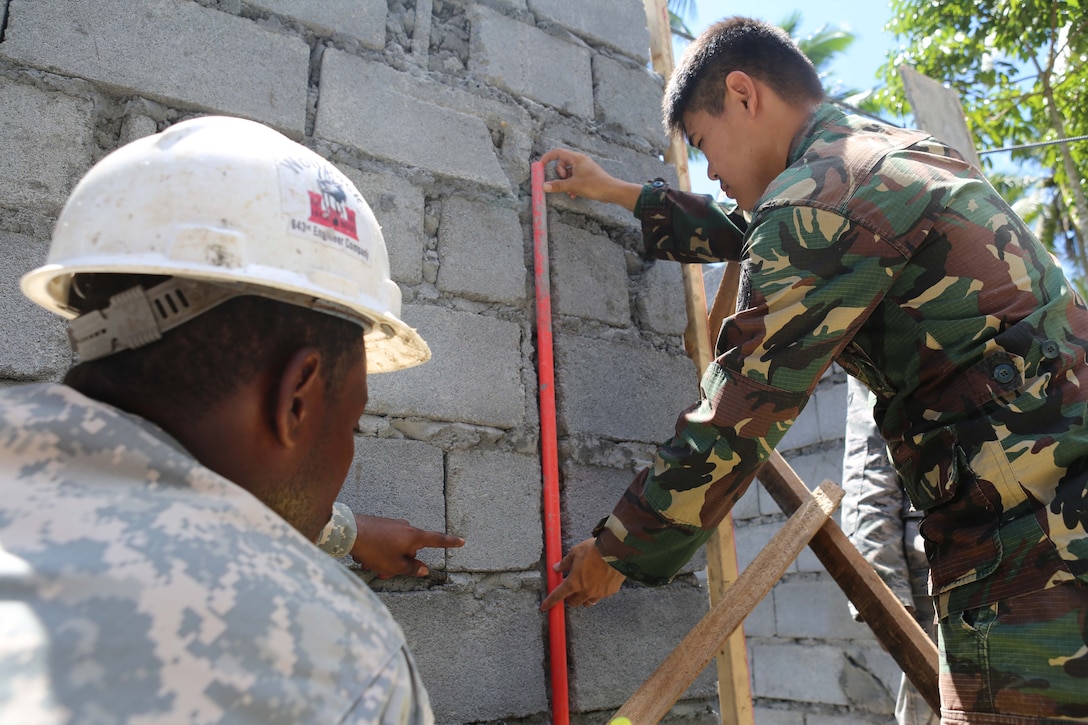 Members of the AFP U.S. armed forces conduct build a comfort room and ...