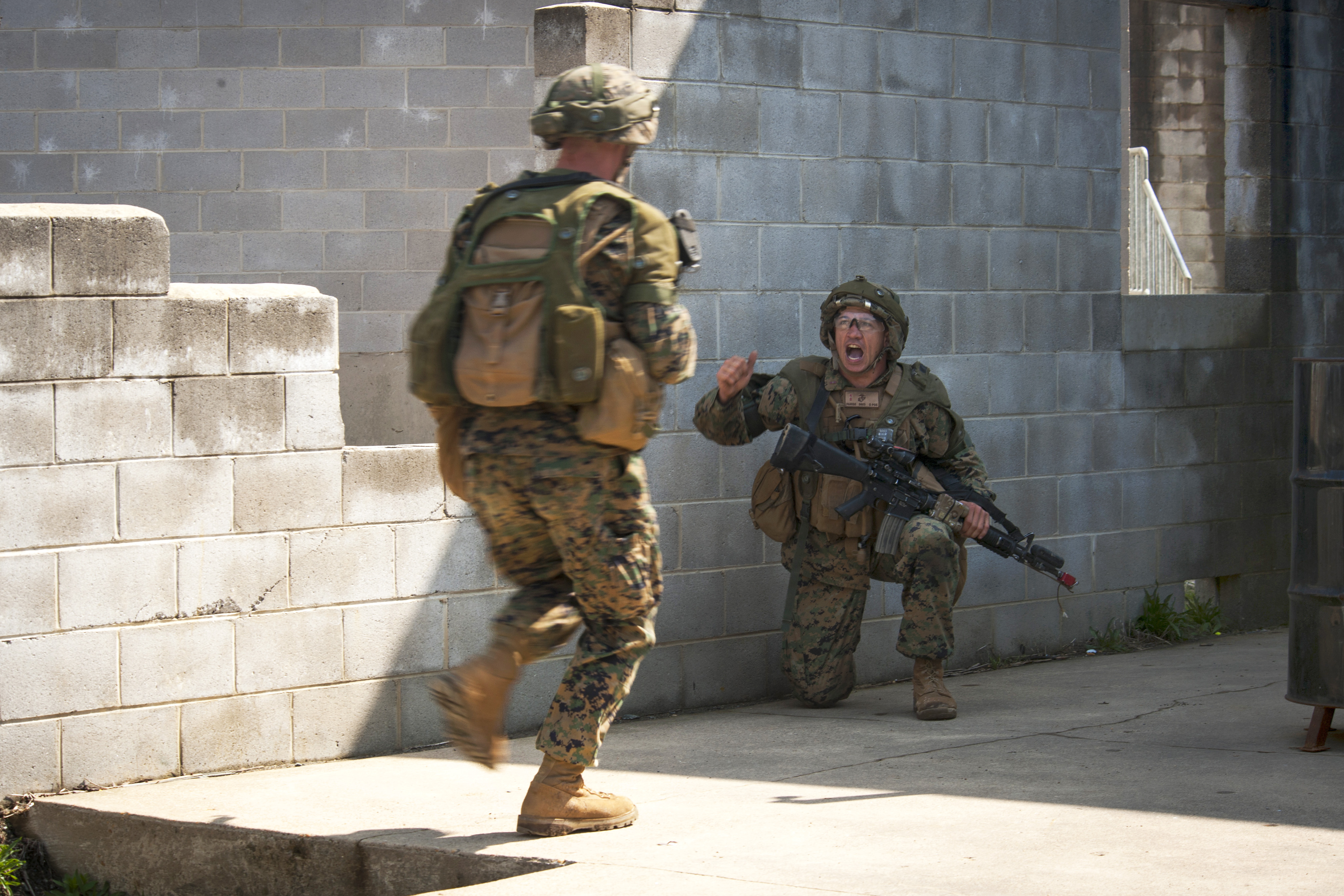 A Marine Corps warrant officer shouts out commands to other officers ...