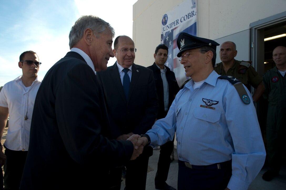 U.S. Defense Secretary Chuck Hagel greets Israeli Brig. Gen. Shahar ...