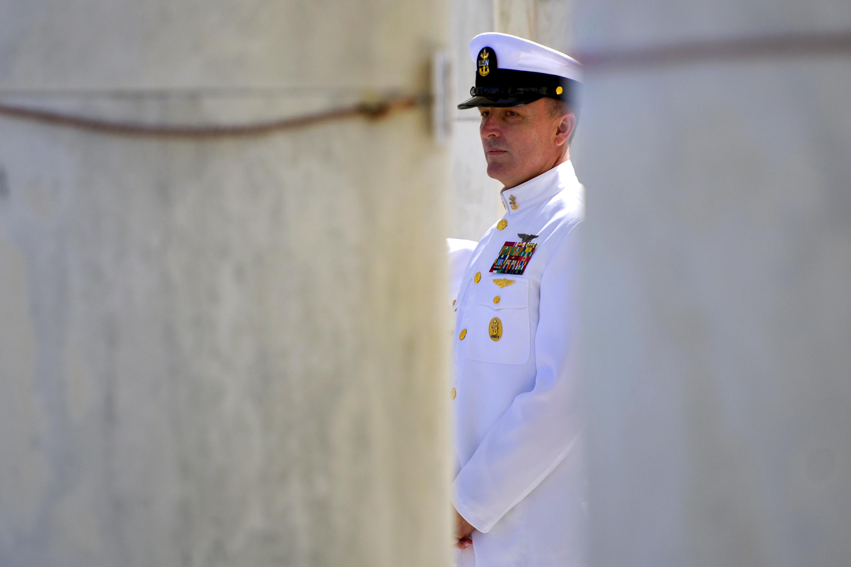 Master Chief Petty Officer of the Navy Michael D. Stevens stands near ...