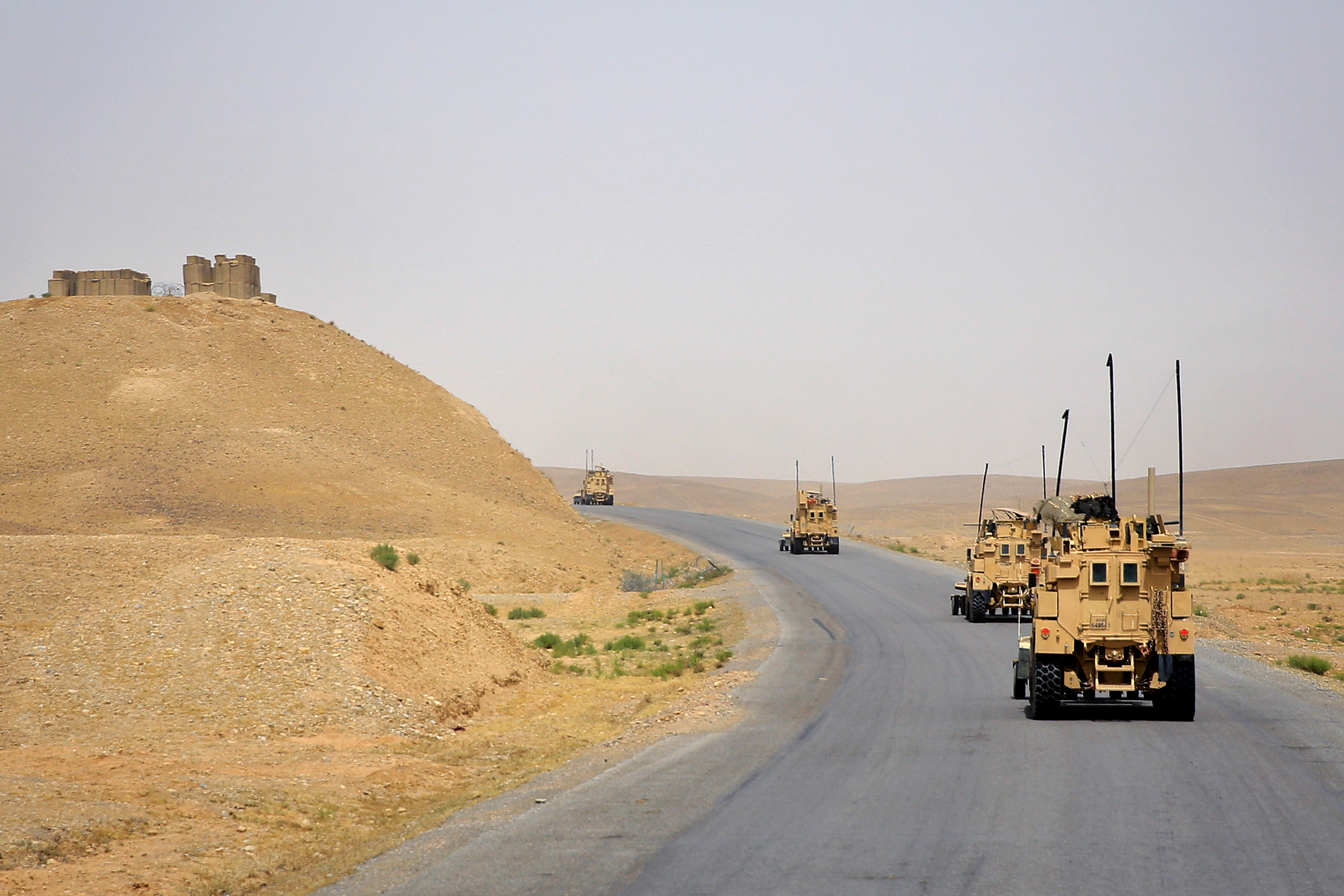 A convoy of U.S. Marine Corps mine-resistant, ambush-protected vehicles ...