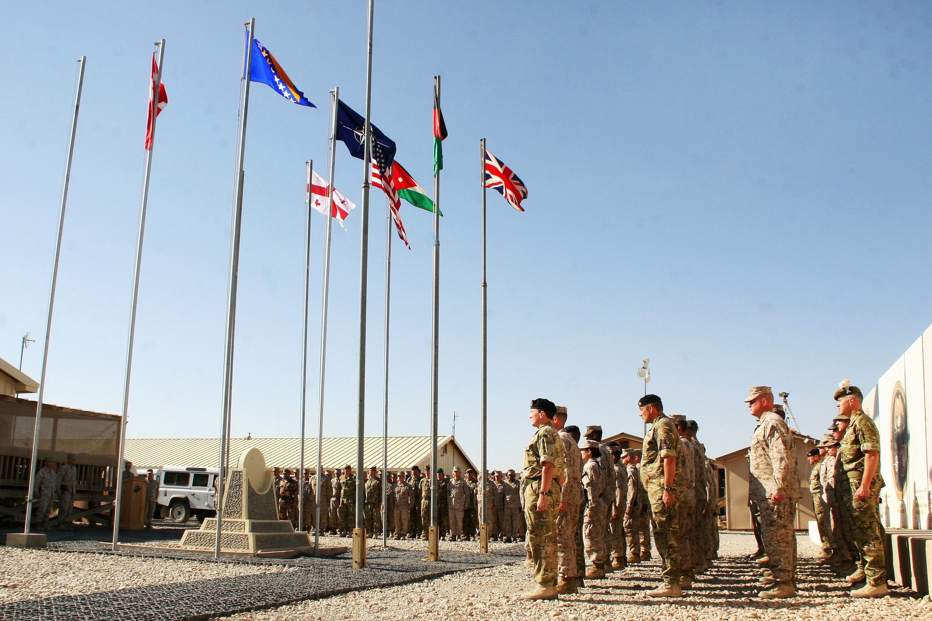 Coalition service members assigned to Regional Command Southwest stand ...