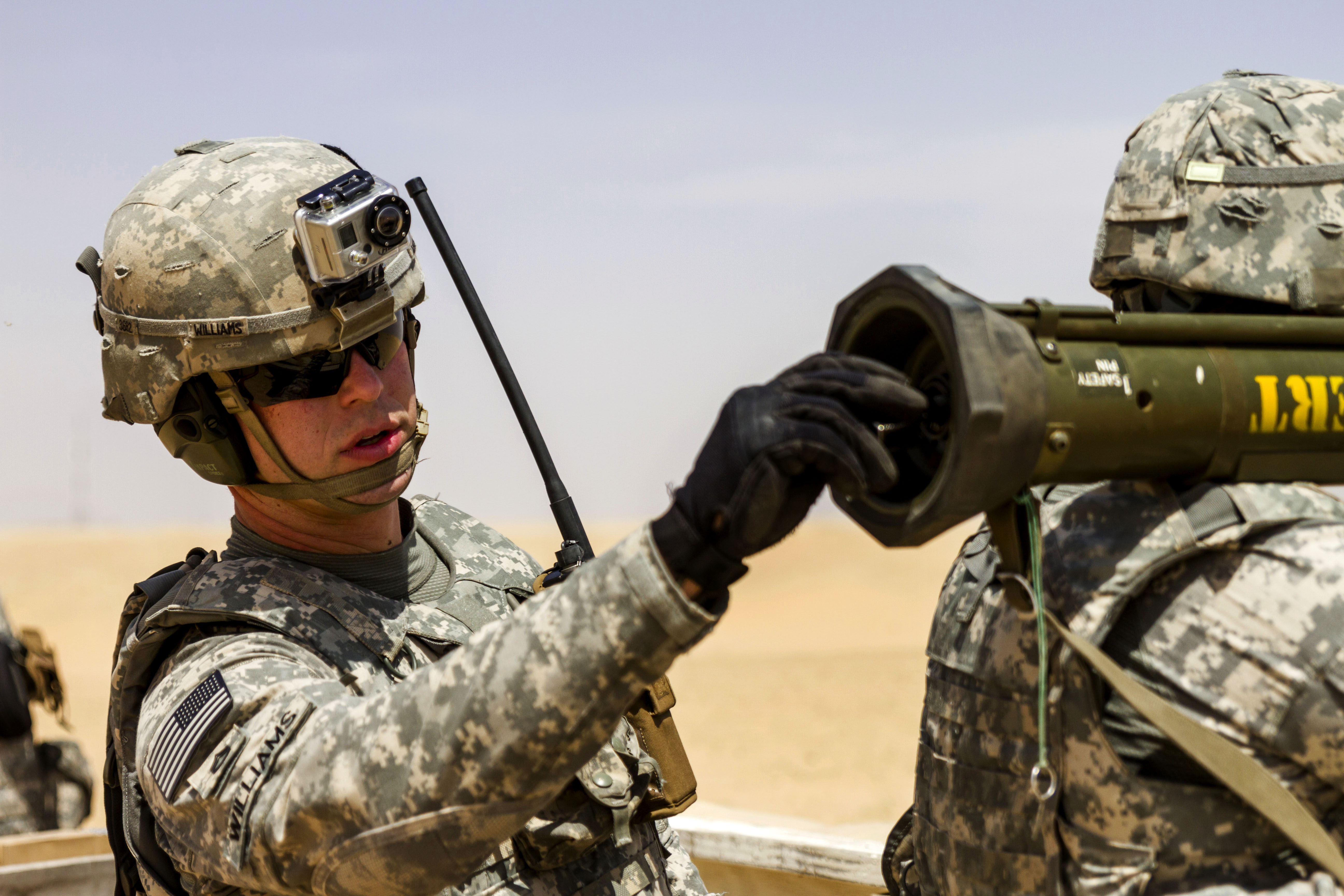 U.S. Army Sgt. 1st Class Williams, left, prepares an AT-4 anti-tank ...