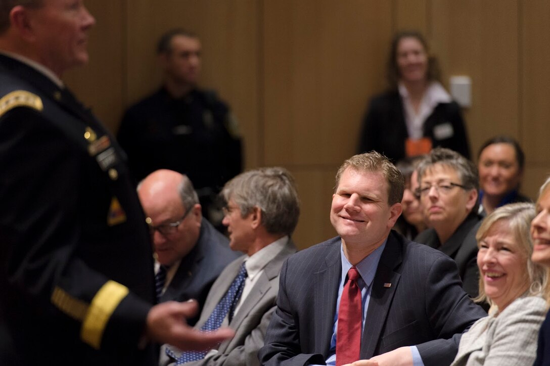 Rep. Dan Maffei of New York, center, smiles as he listens to Army Gen ...
