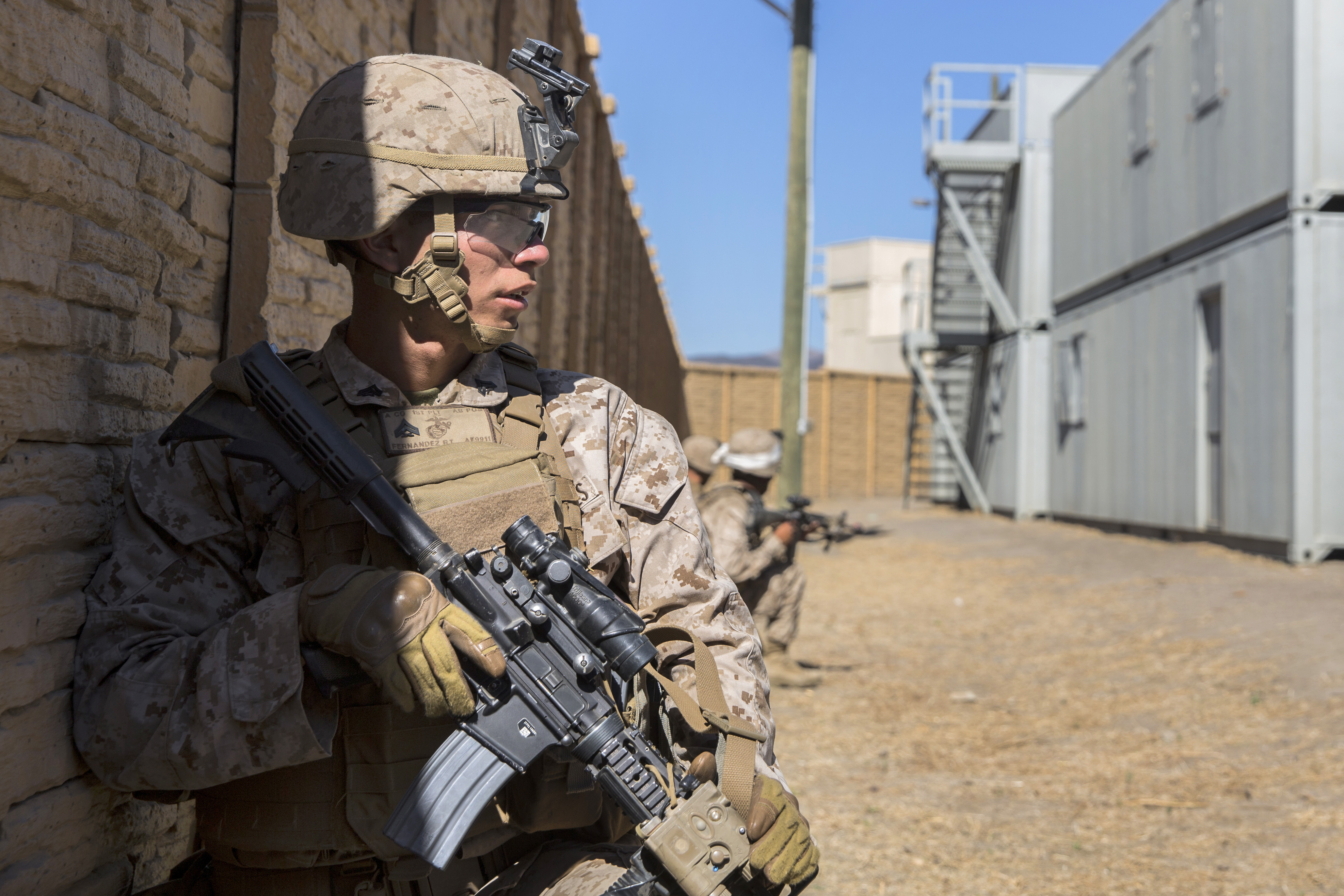 U.S. Marine Cpl. Roman Fernandez provides security during a vertical ...