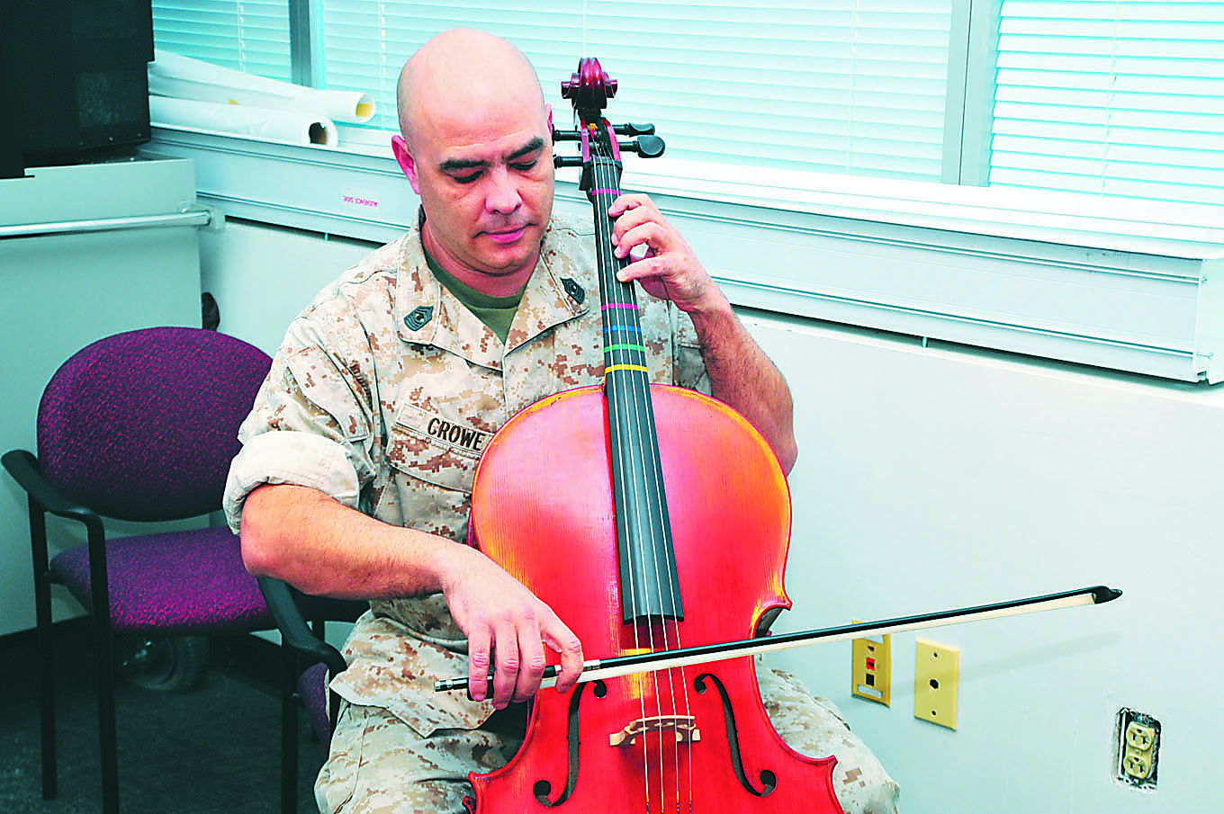 Artilleryman takes up the cello