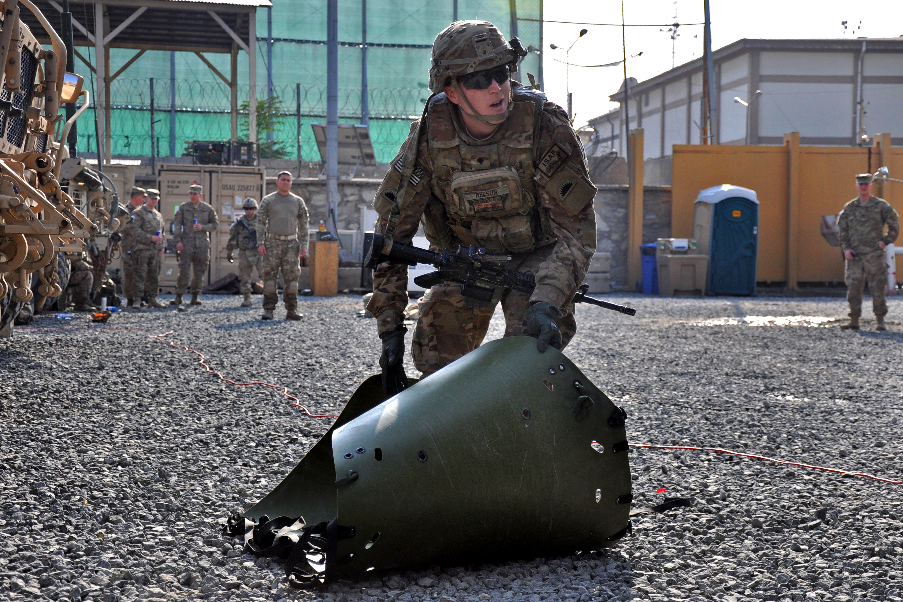 U.S. Army Spc. Evan P. Nelson prepares a Skedco litter during a ...