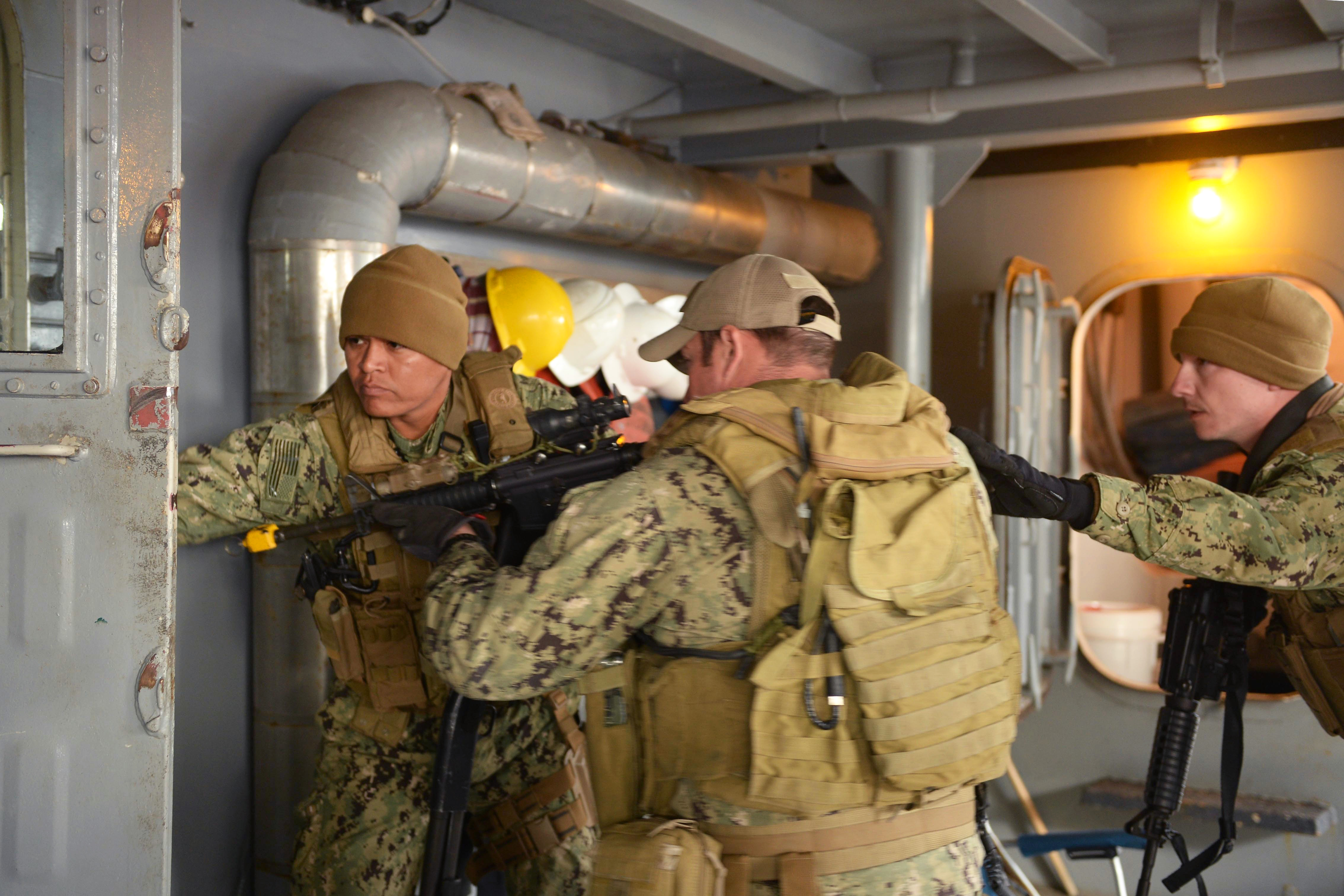 Sailors make an entry during a visit, board, search and seizure ...