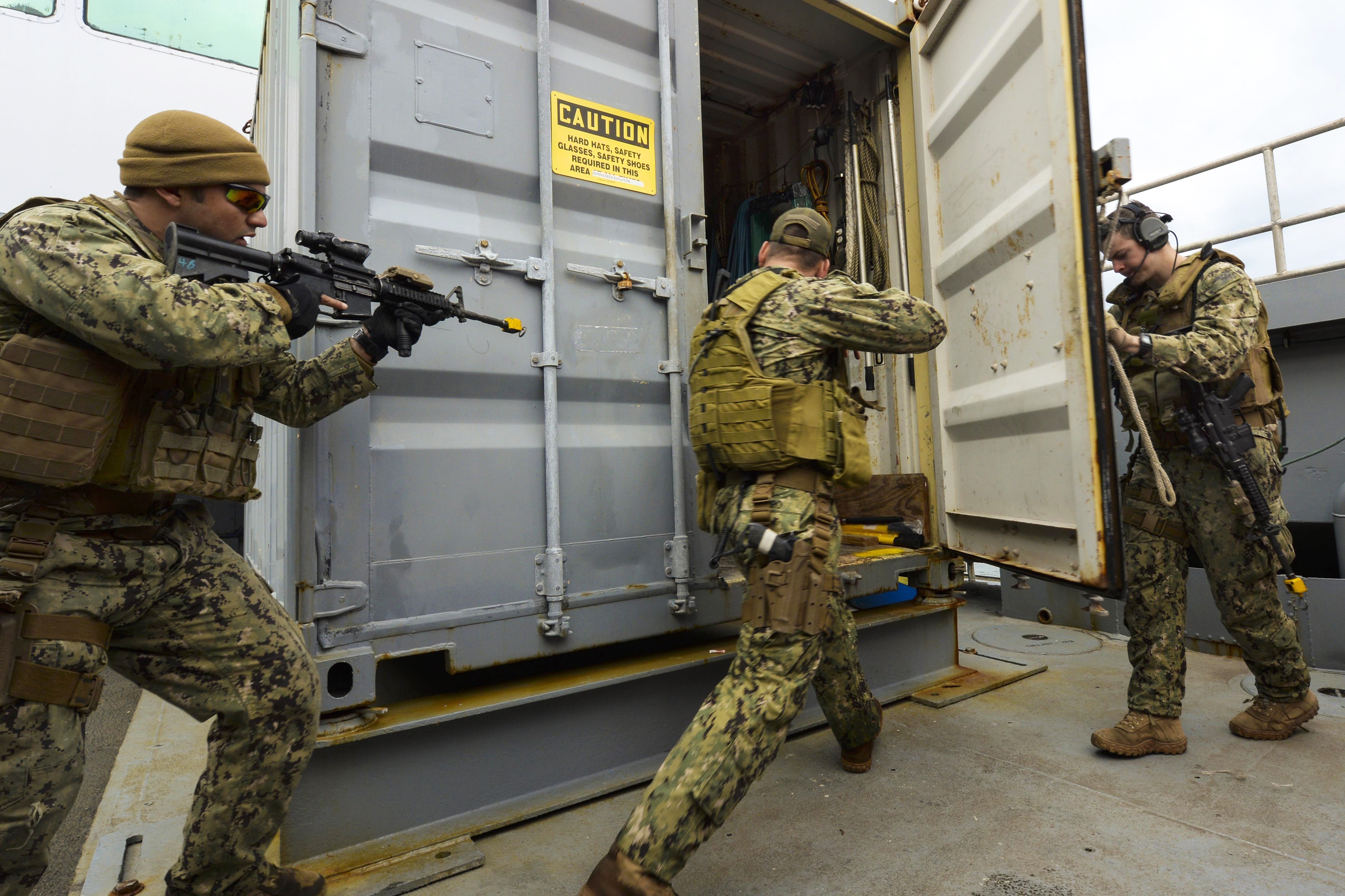 Navy Petty Officer 2nd Class Dayron Mas, left, Petty Officer 1st Class ...