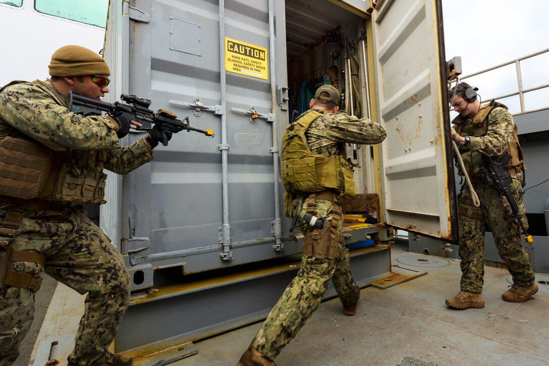 Navy Petty Officer 2nd Class Dayron Mas, left, Petty Officer 1st Class ...