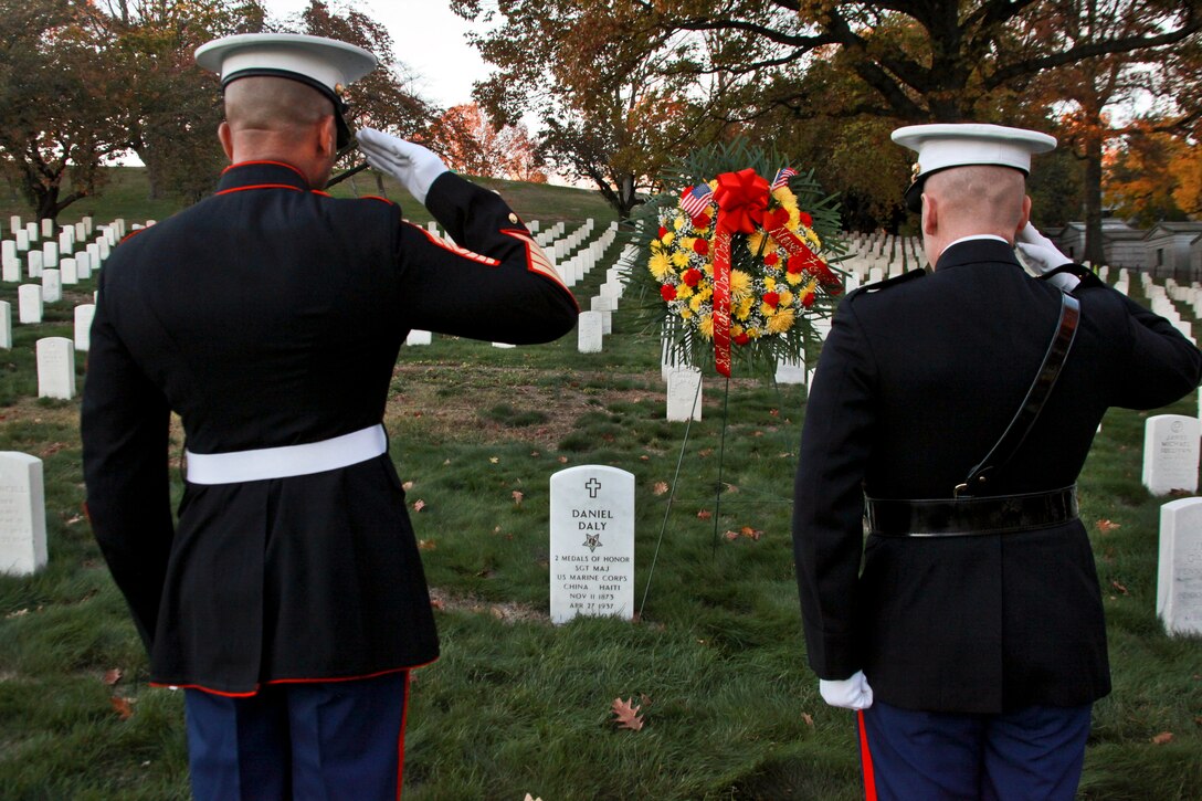 Marine Corps Col. James Iulo and Sgt. Maj. Irvin Howard lay a wreath to ...