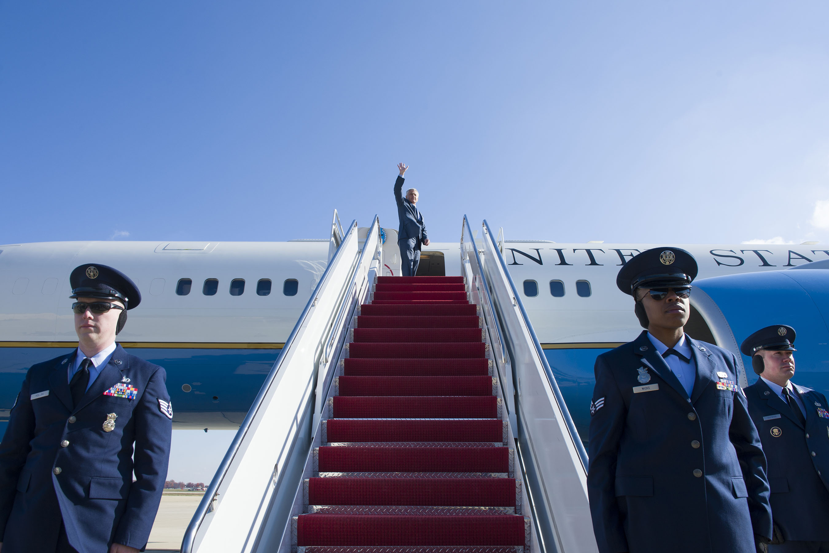 Defense Secretary Chuck Hagel waves before boarding a plane on Joint ...