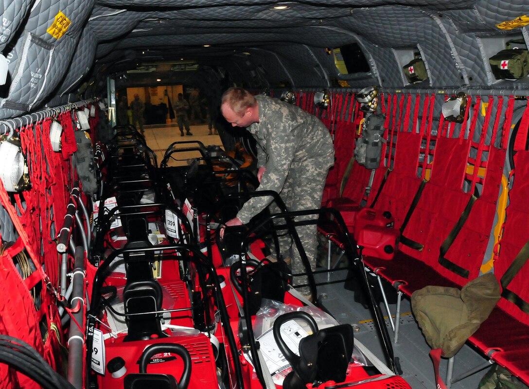 Army National Guard Staff Sgt. Jeff Lentz prepares snow blowers for ...