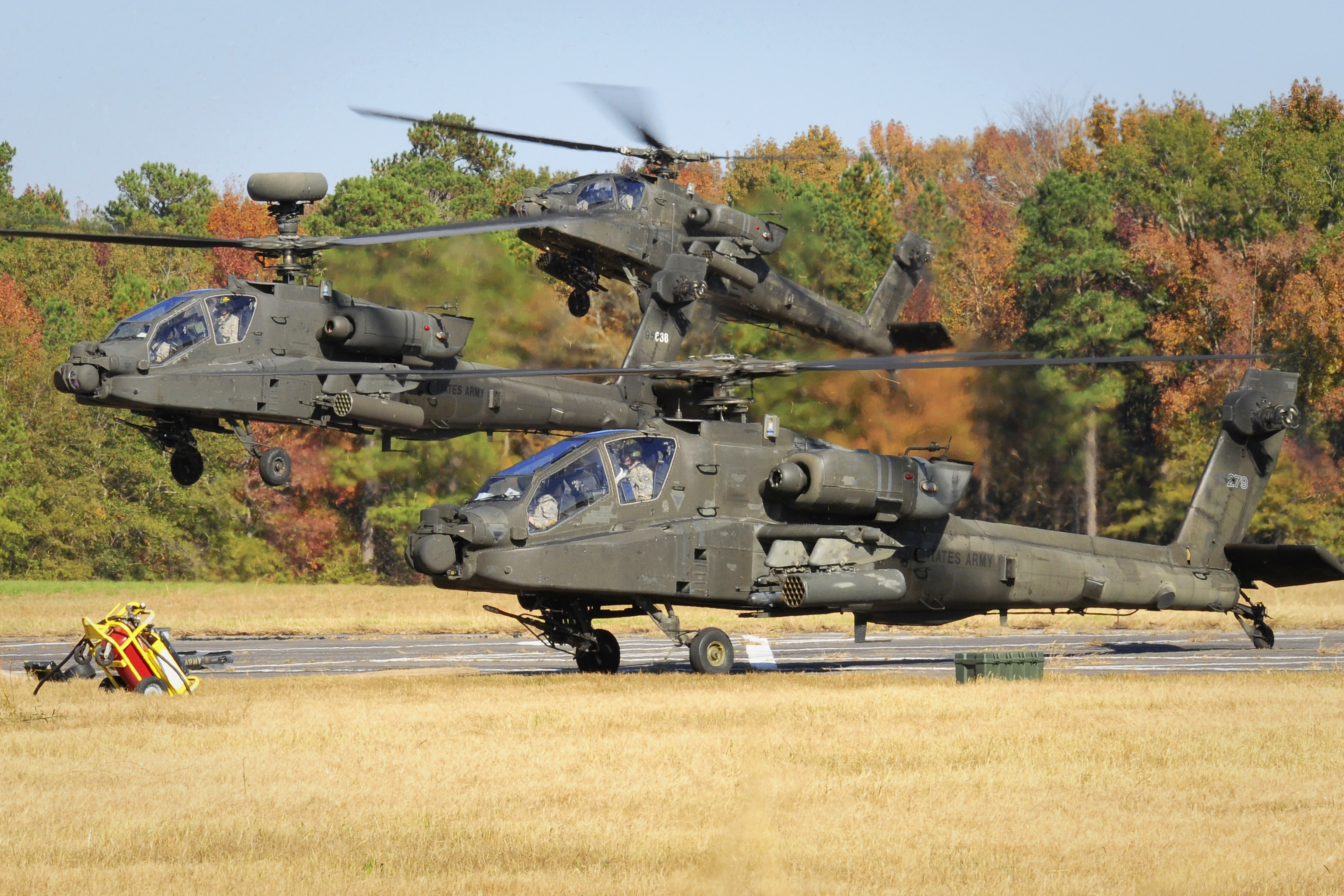 AH-64D Apache helicopters take off for a mission during exercise ...