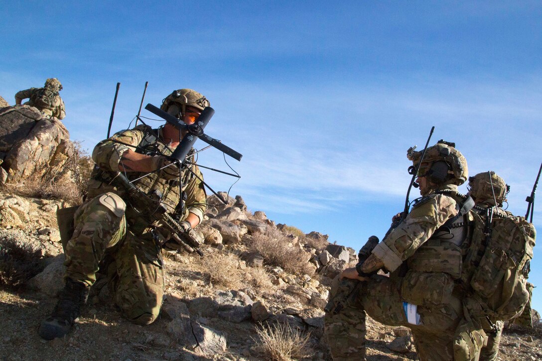 Army Rangers communicate to higher command before assaulting an enemy ...