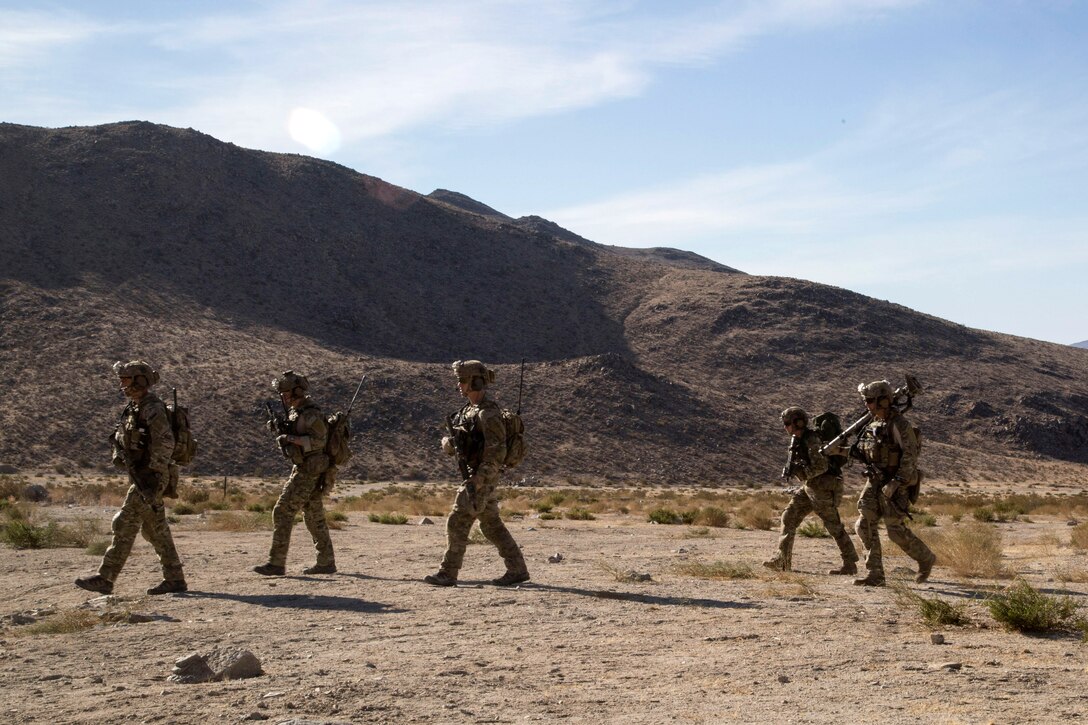 Army Rangers tactically move out before conducting a raid on an enemy ...