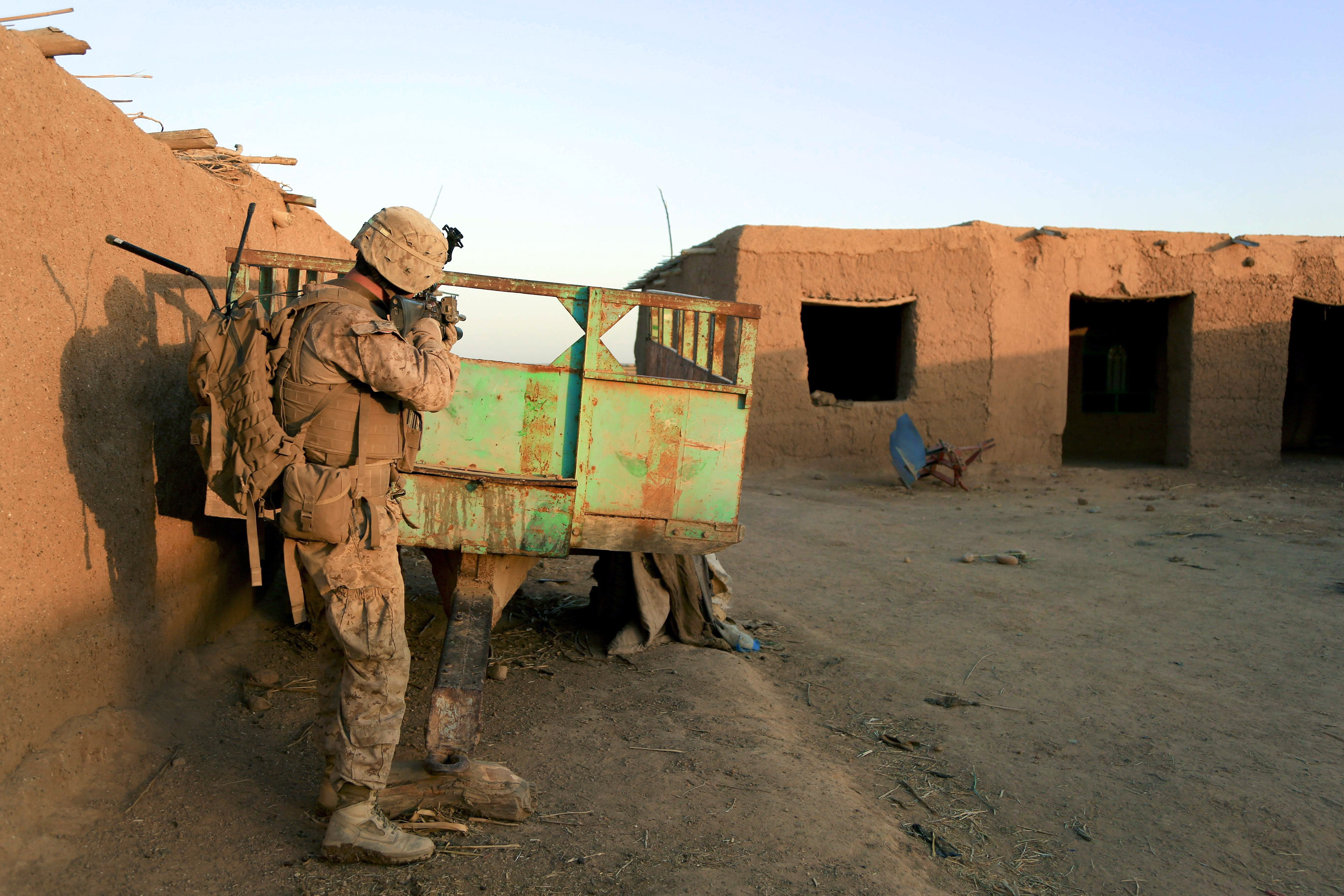 U.S. Marine Corps Lance Cpl. Daniel Keeler observes his surroundings ...