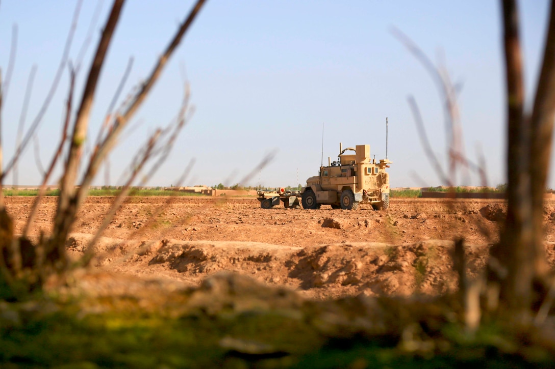 U.S. Marines conduct a mounted patrol in a mine-resistant, ambush ...
