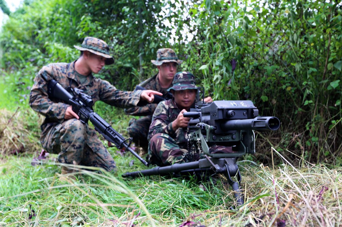U.S. Marine Corps Cpl. Morrison Diep and Cpl. Brian McLaghlin provide ...