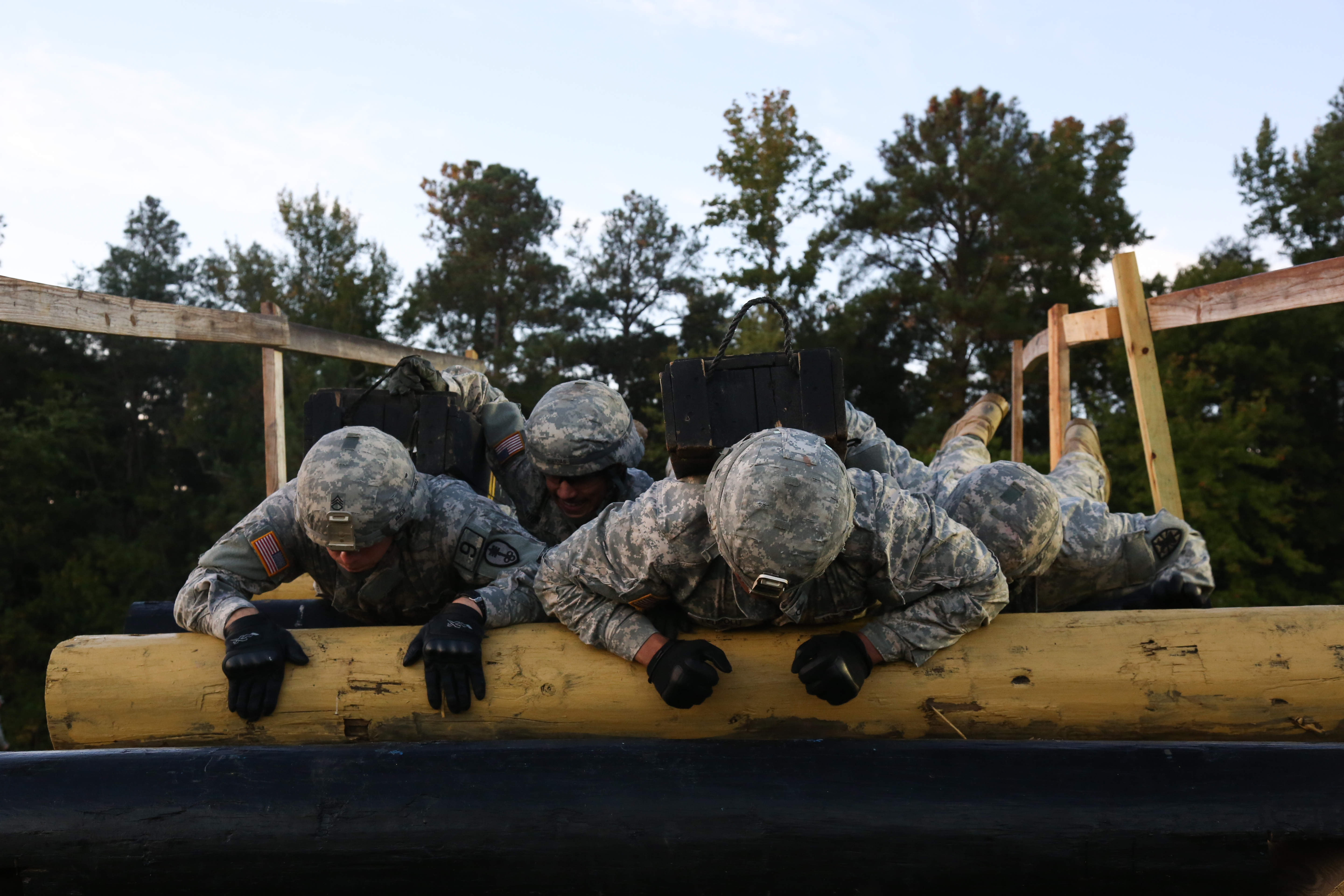 Army Staff Sgt. Luke Klein, far left, navigates the obstacle course ...