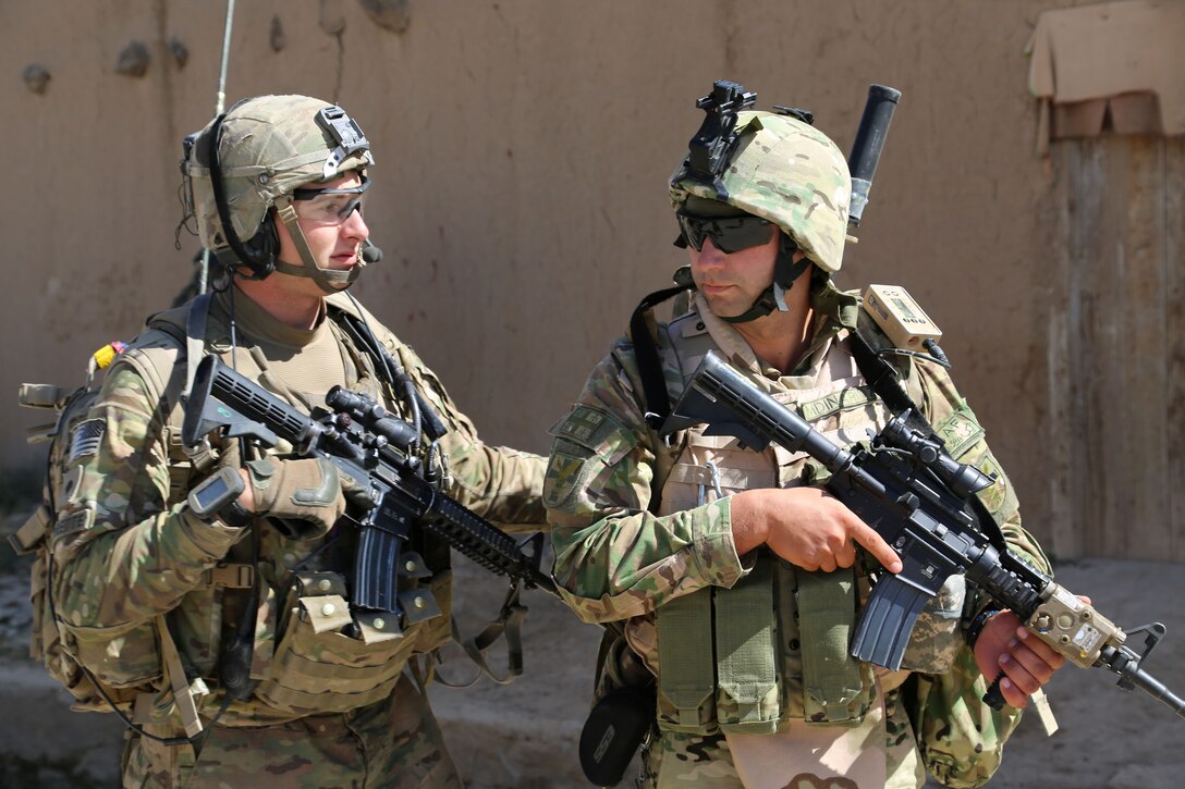 U.S. Army Spc. Cameron Verrette, left, assists Georgian ground forces ...