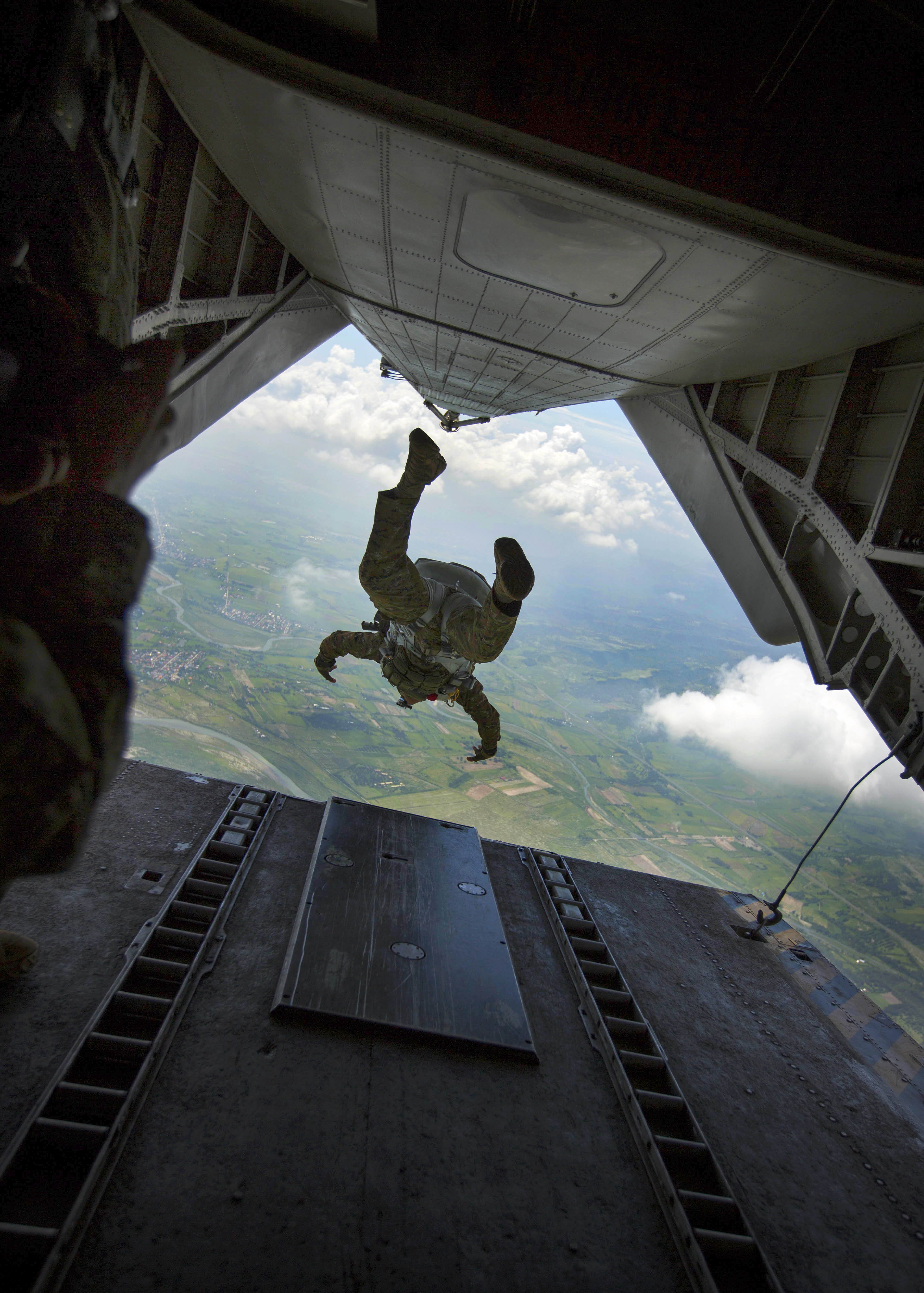 Philippine Army Maj. Velmor Manaois conducts a free fall jump from a U ...