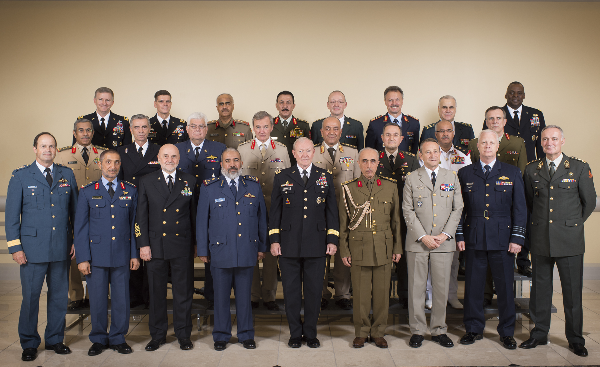 Military leaders from 21 nations take a group photo at the start of a ...