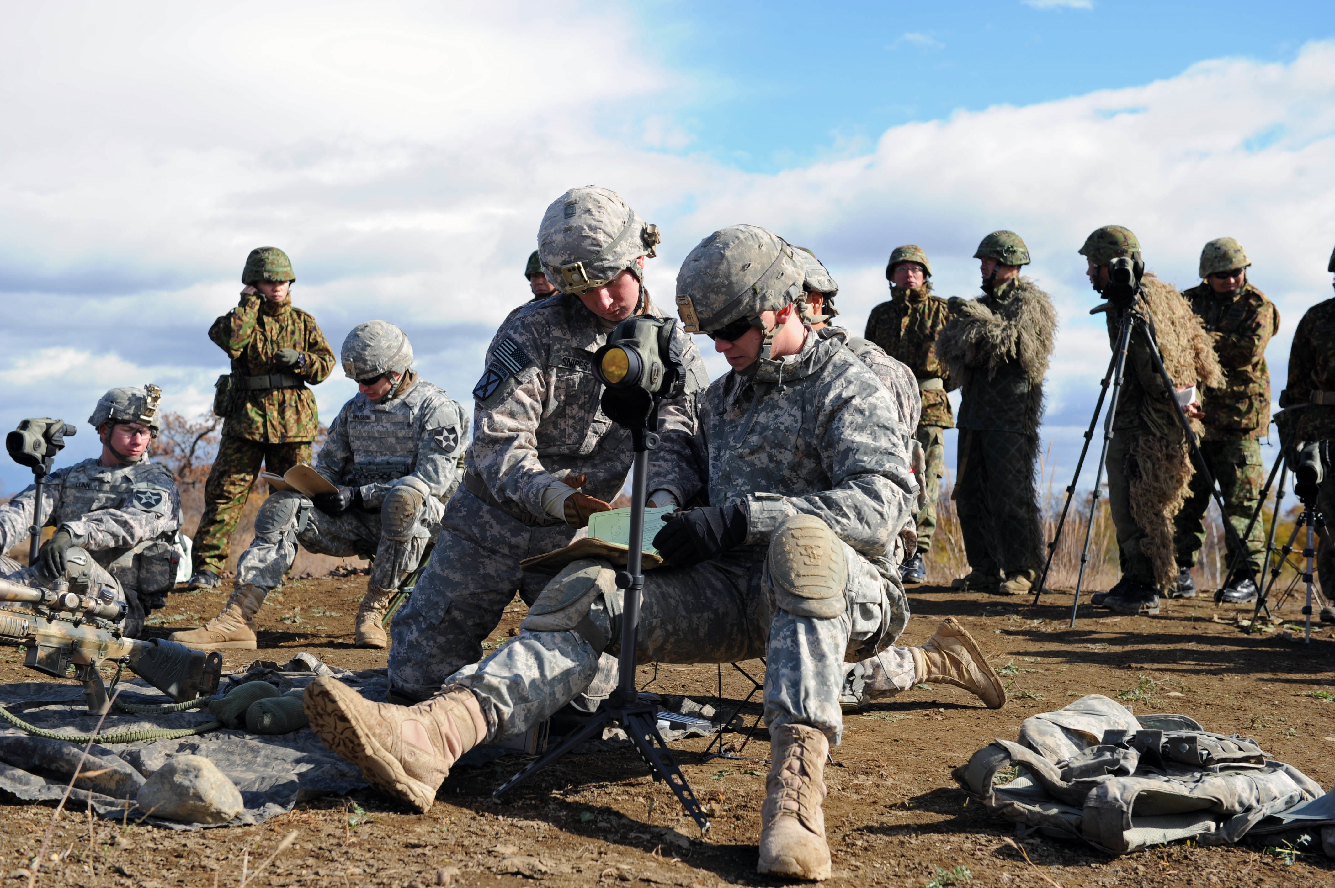 U.S. Army Staff Sgt. Perrin Snipes, left, and Spc. Jarret Jacobi, right ...