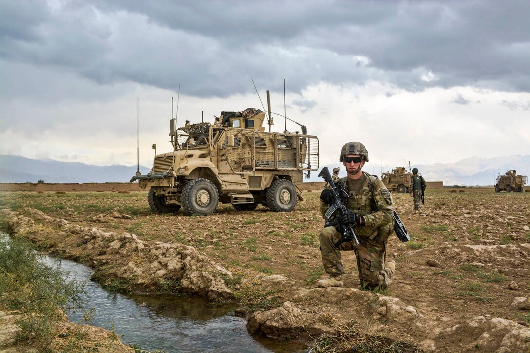U.S. Army Spc. Michael Berna counts personnel after a patrol through ...