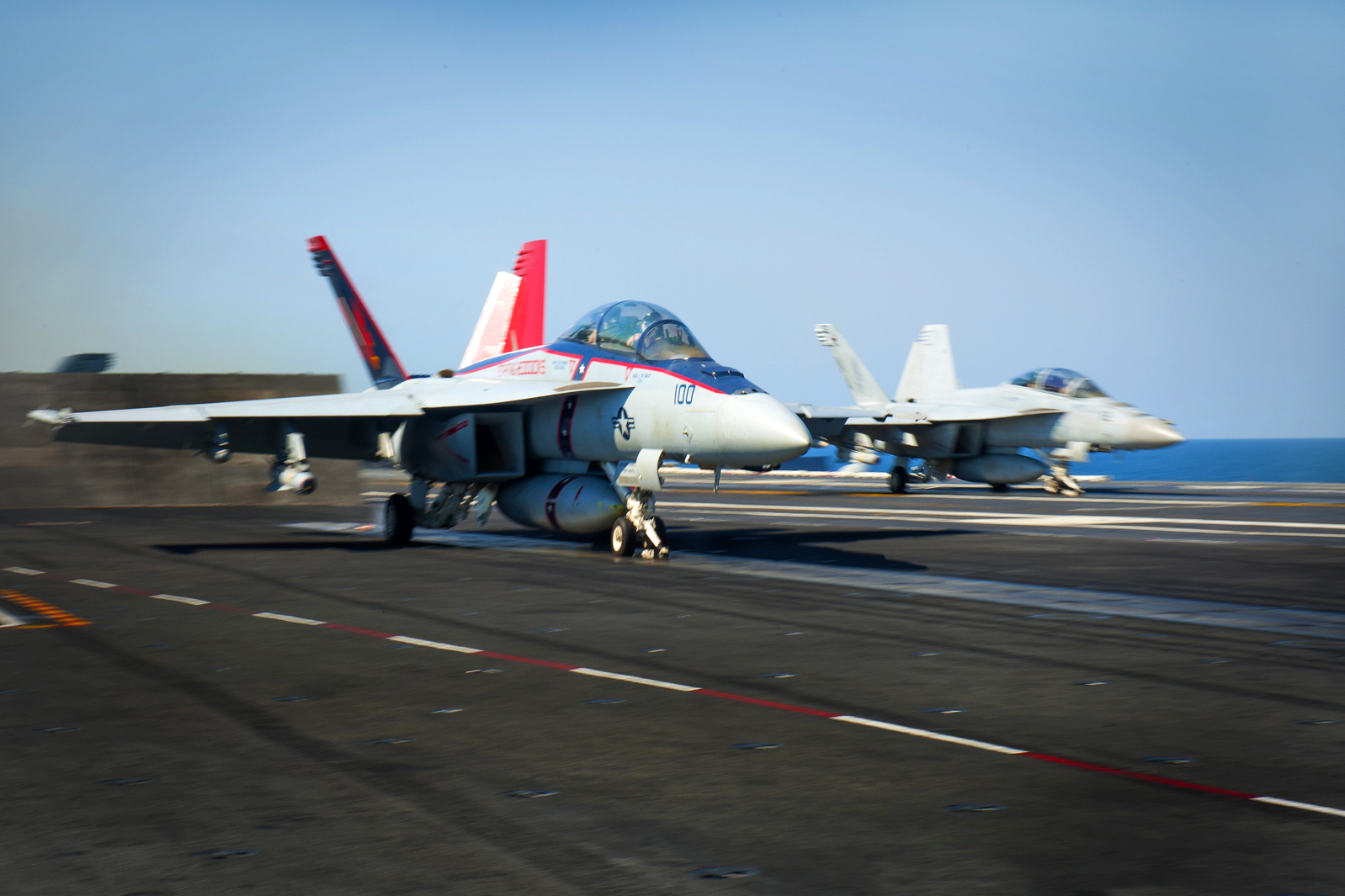 F/A-18F Super Hornets from Strike Fighter Squadron 22 prepare to launch ...