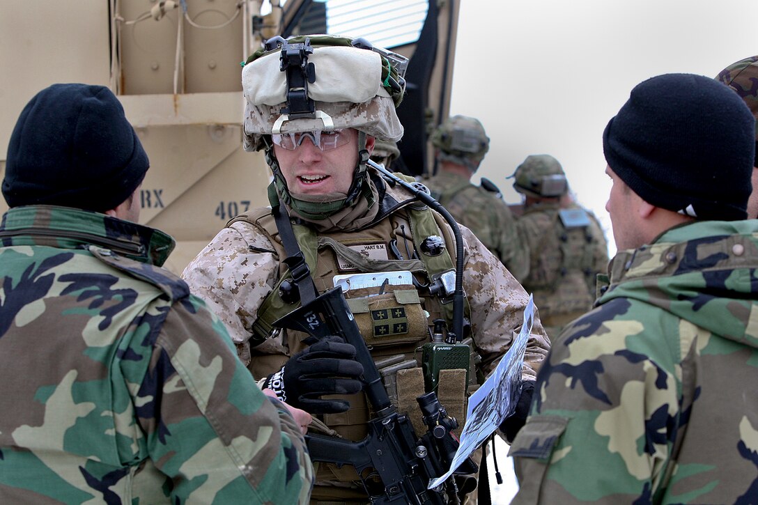 U.S. Marine Capt. Brian Hart offers guidance to Georgian soldiers on ...