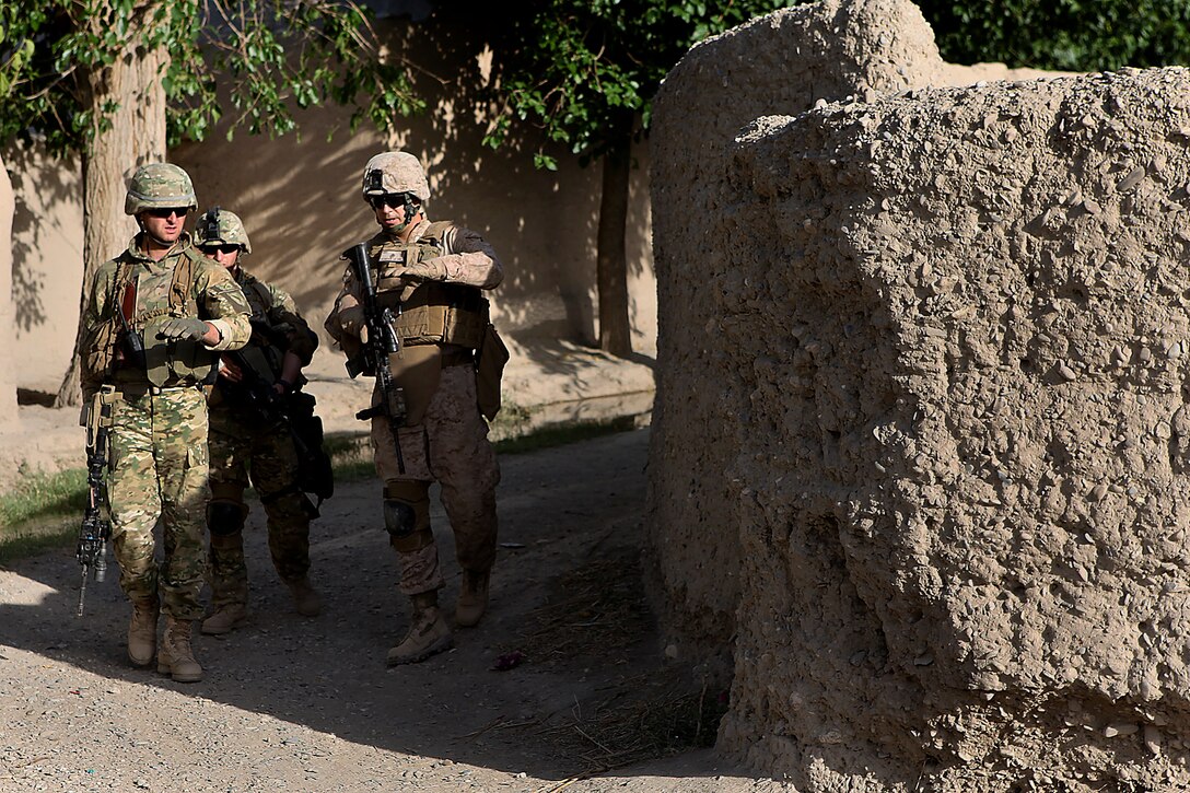U.S. Marine Master Sgt. Andrew Michaelson performs an area patrol with ...