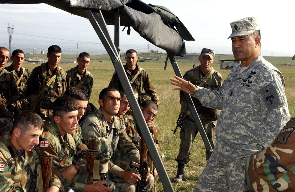 U.S. Army Command Sgt. Maj. Iuniasolua Savusa speaks to soldiers from ...