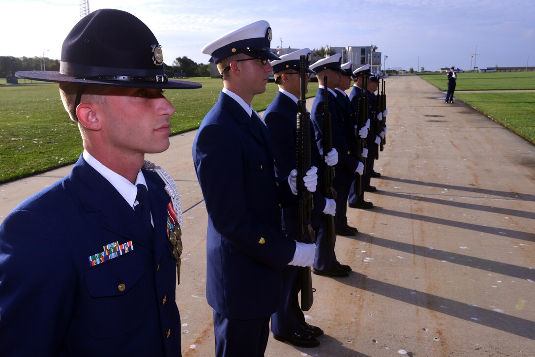 Coast Guard Petty Officer 1st Class Skyler Smith stands by the recruit ...