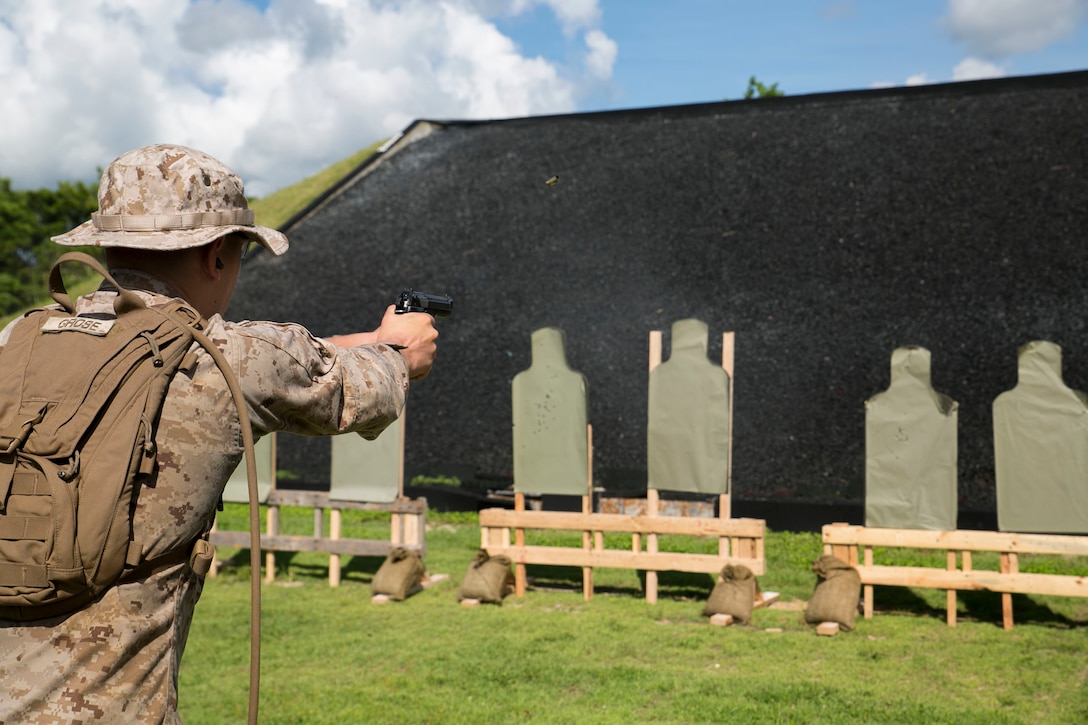 Marines engage in close-quarters pistol training