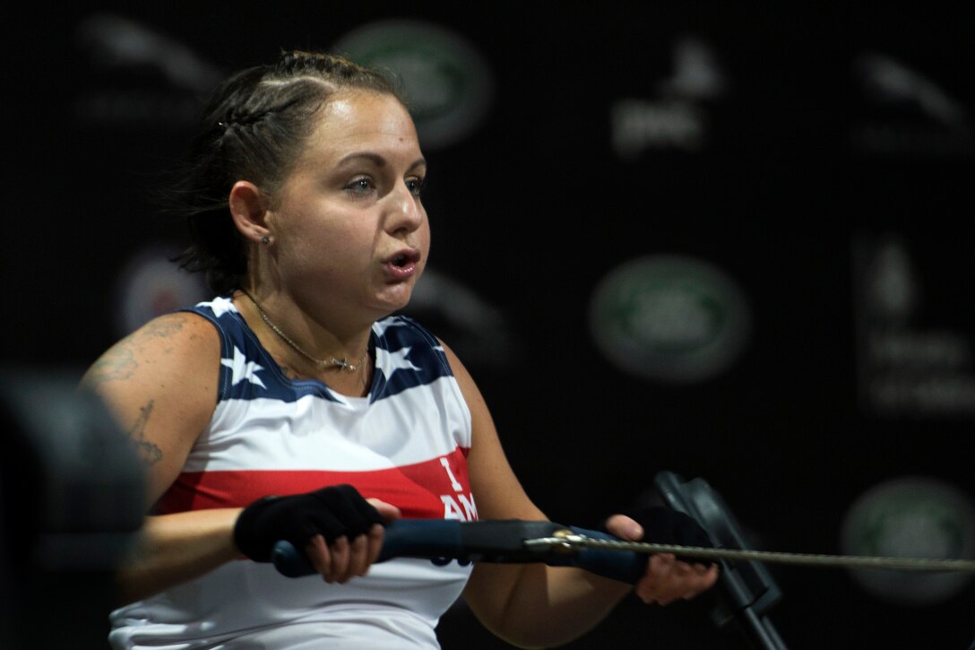 U.S. Air Force Staff Sgt. Melissa Coduti competes in indoor rowing ...