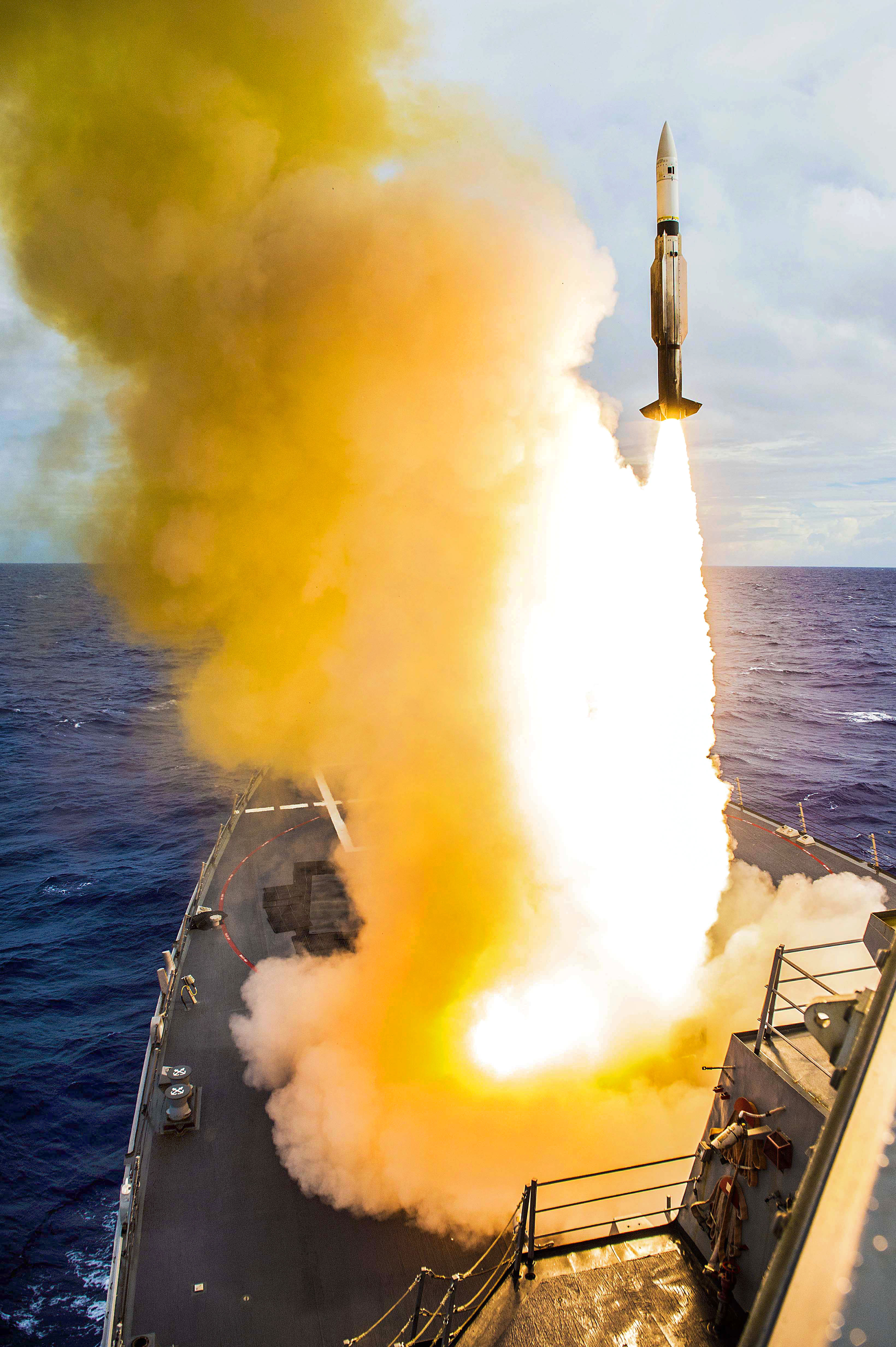 The guided-missile destroyer USS Mustin launches an SM-2 missile during ...