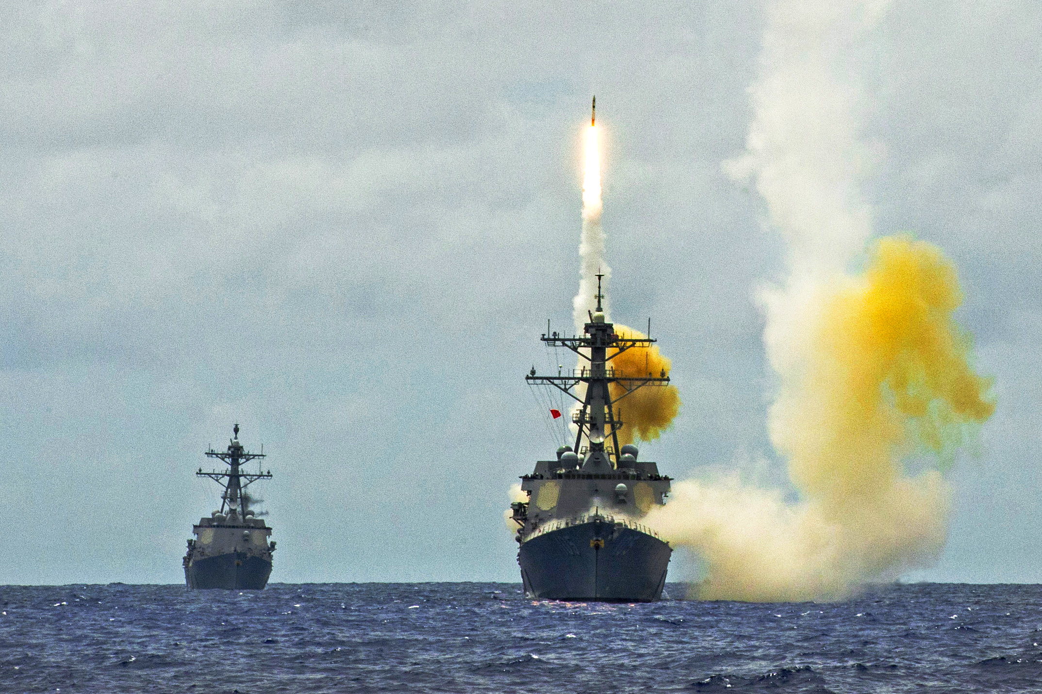 The Arleigh Burke-class guided-missile destroyer USS Dewey launches a ...