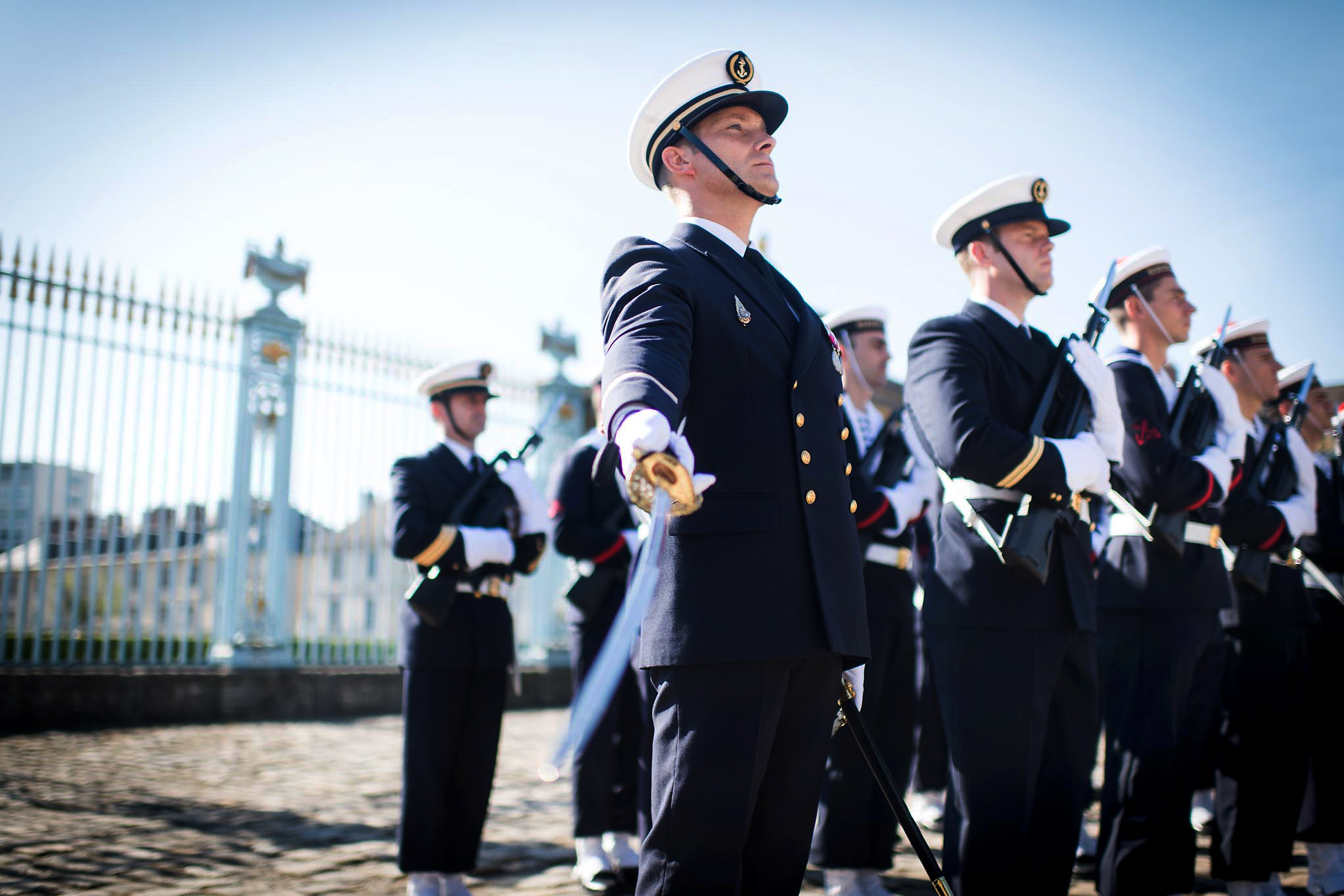 Members of a French military honor guard stand in formation during a ...