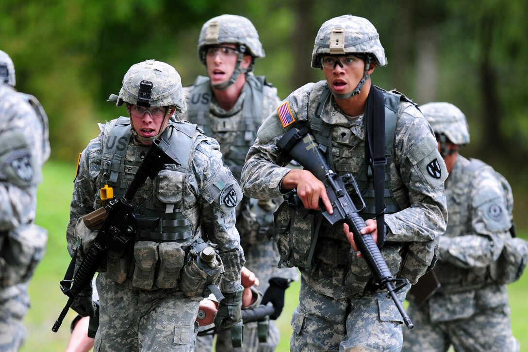U.S. Army Staff Sgt. Jordan Stipp, left, U.S. Army 1st Lt. Michael ...