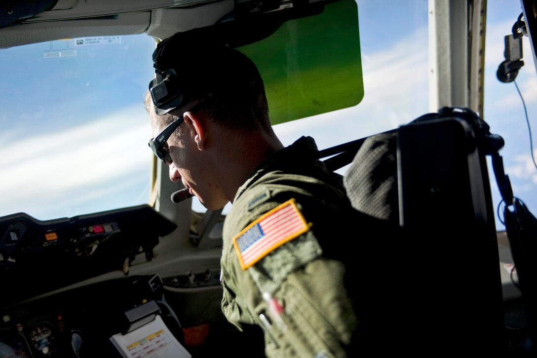 U.S. Air Force 1st Lt. Michael Sare conducts refueling operations ...