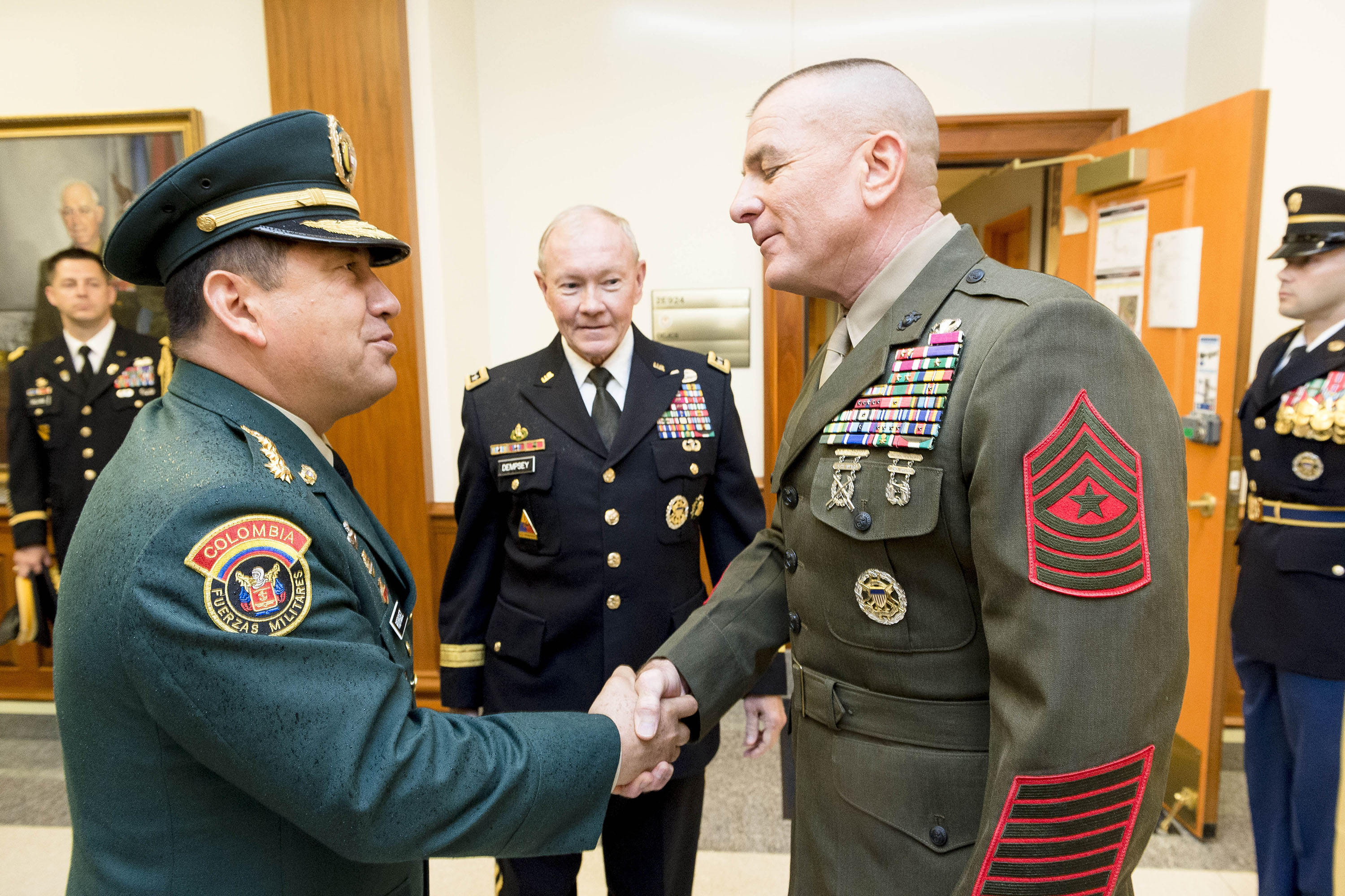 U.S. Marine Corps Sgt. Maj. Bryan B. Battaglia, right, senior enlisted ...