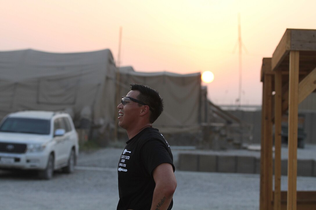 U.S. Army Staff Sgt. Jose Gutierrez takes several deep breaths after ...