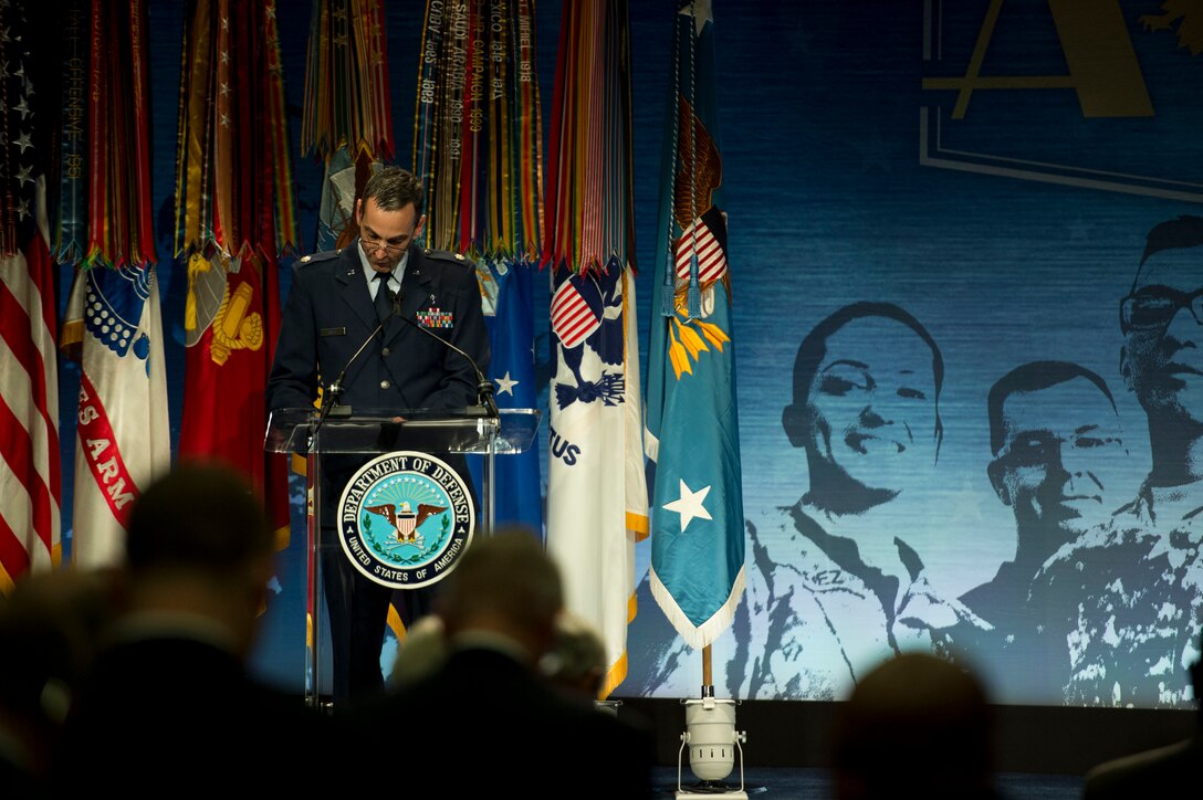 An Air Force chaplain gives the invocation during the Secretary of ...
