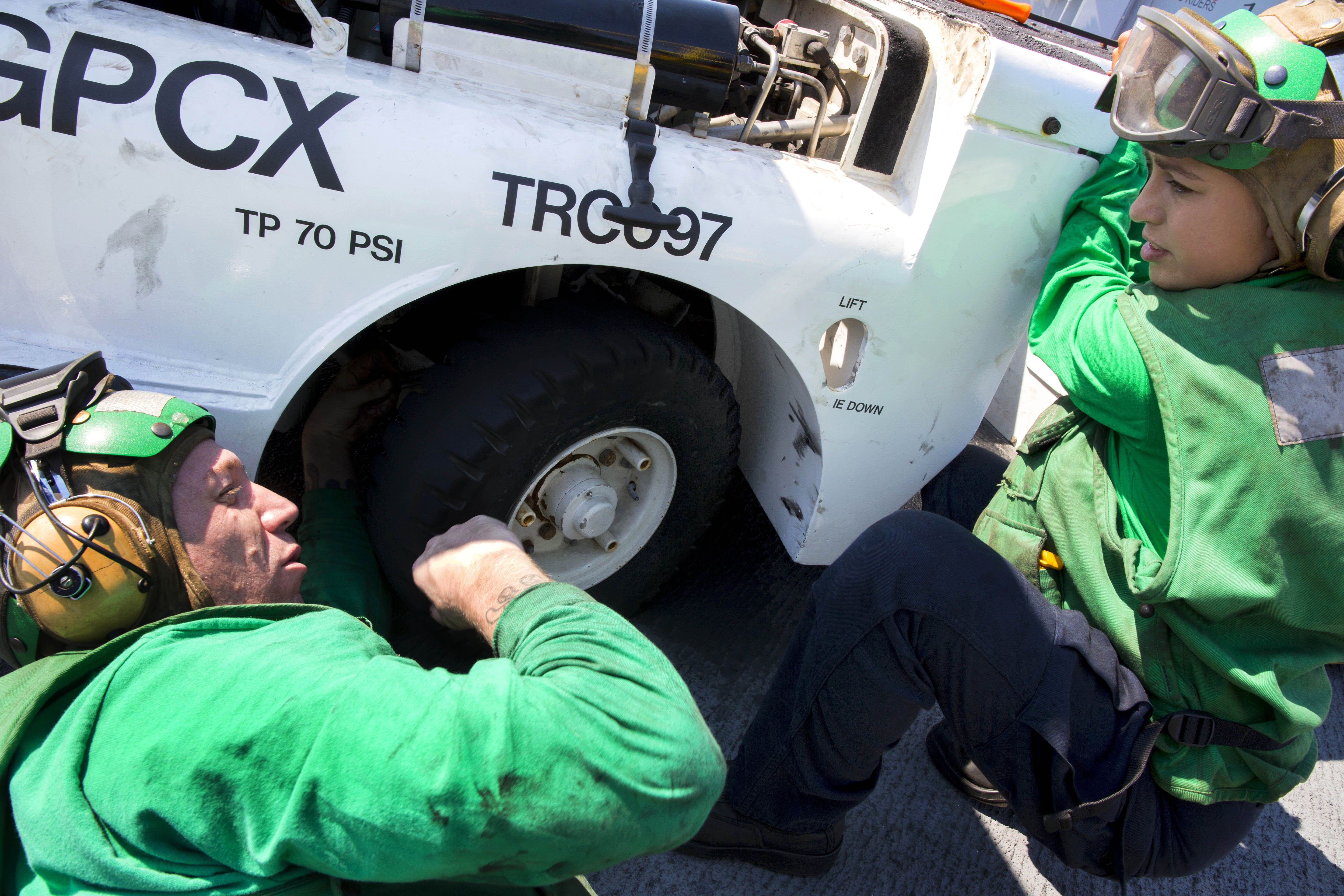 U.S. Navy Petty Officer 2nd Class Benjamin Shaw, left, and U.S. Navy ...
