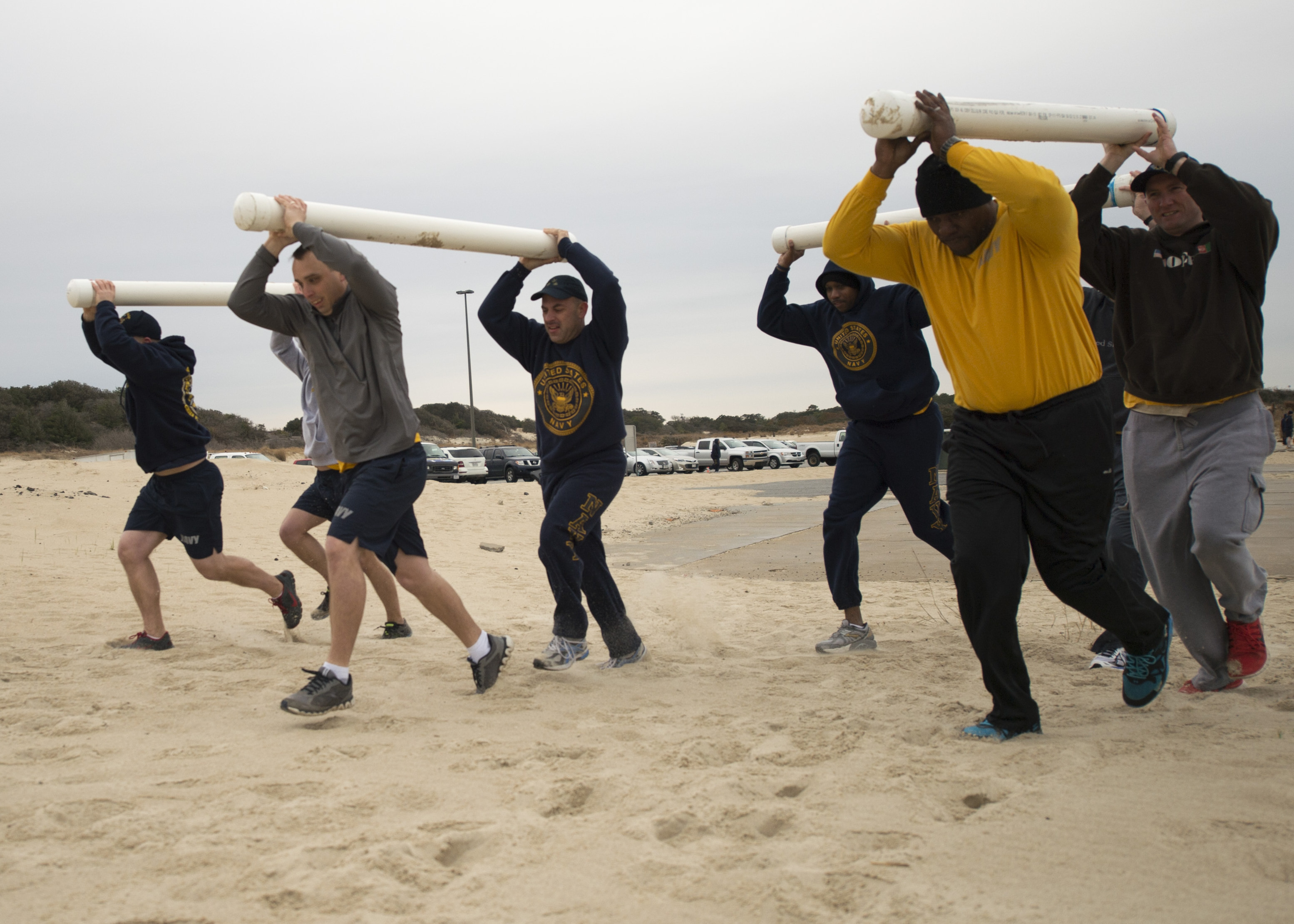 Teams of Navy Chief Petty Officers participate in a PVC pipe relay at ...
