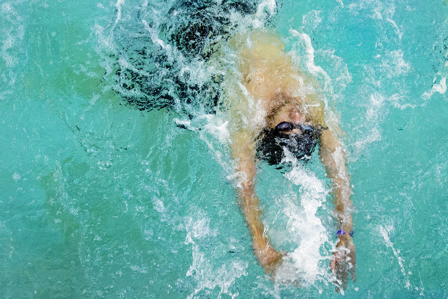 Retired Army Staff Sgt. Tim Payne finishes his backstroke heat during ...