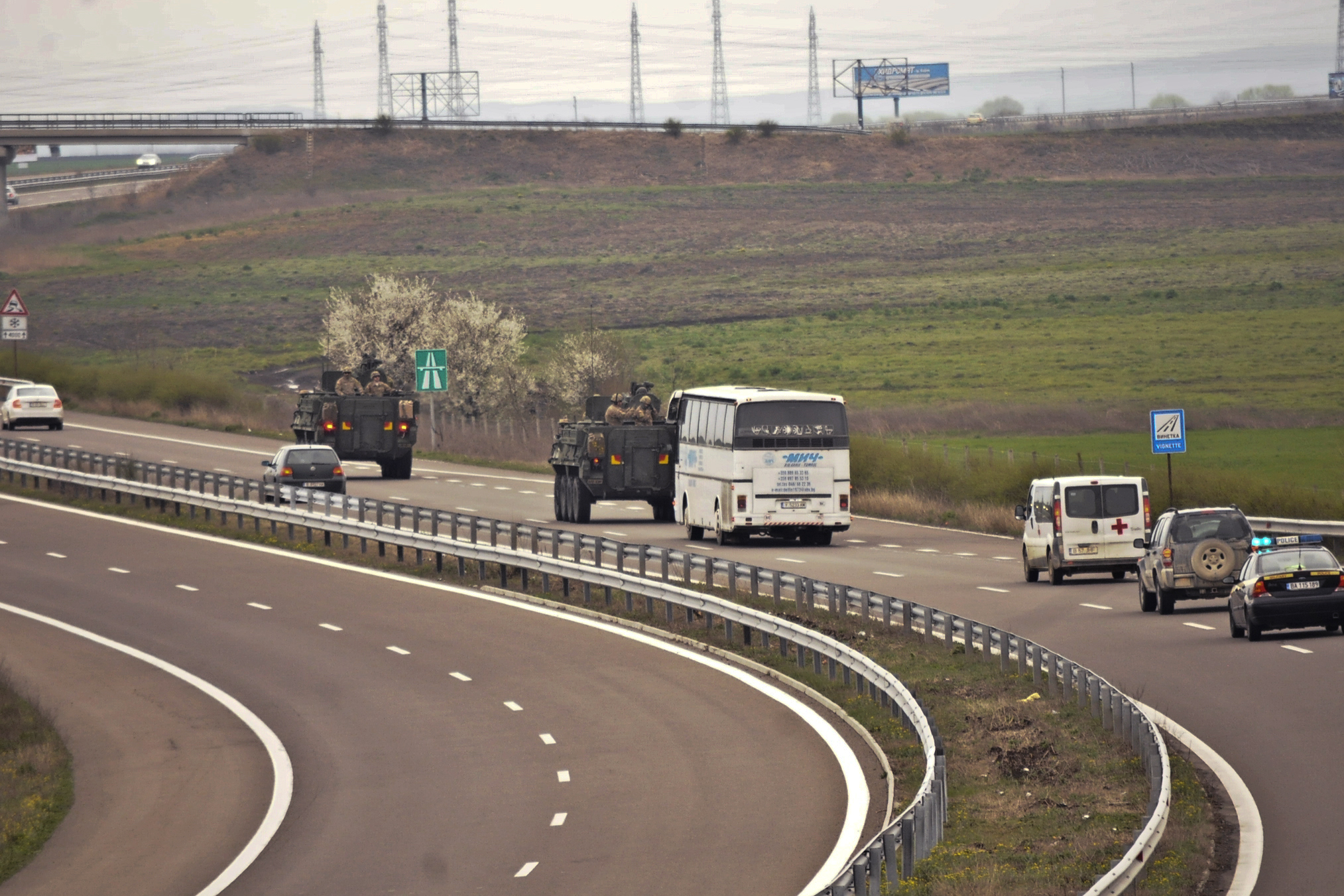 U.S. soldiers in Stryker Combat Vehicles conduct a 97-kilometer convoy ...